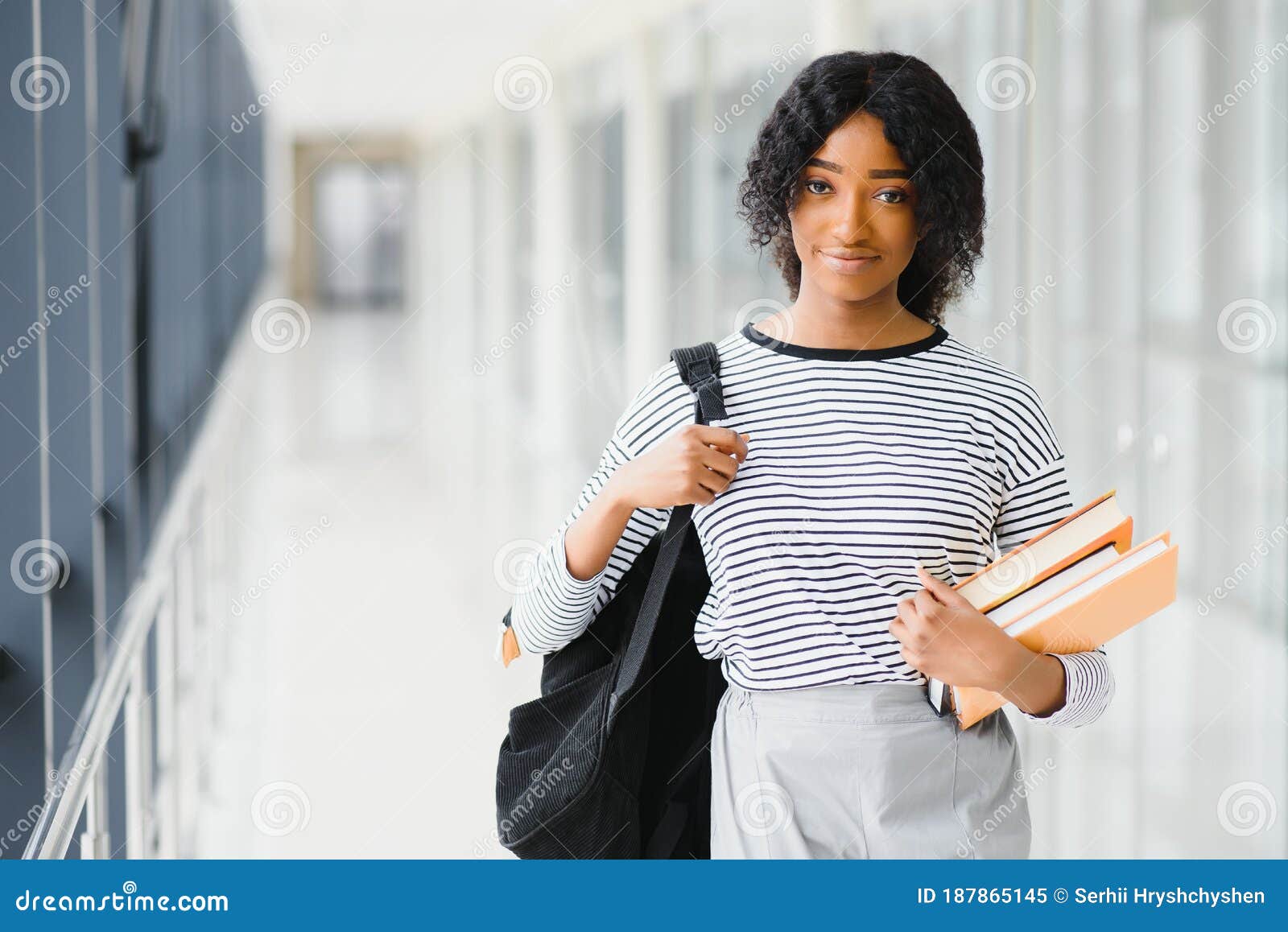 Side View of African American Student Sitting on Floor and Reading Book ...