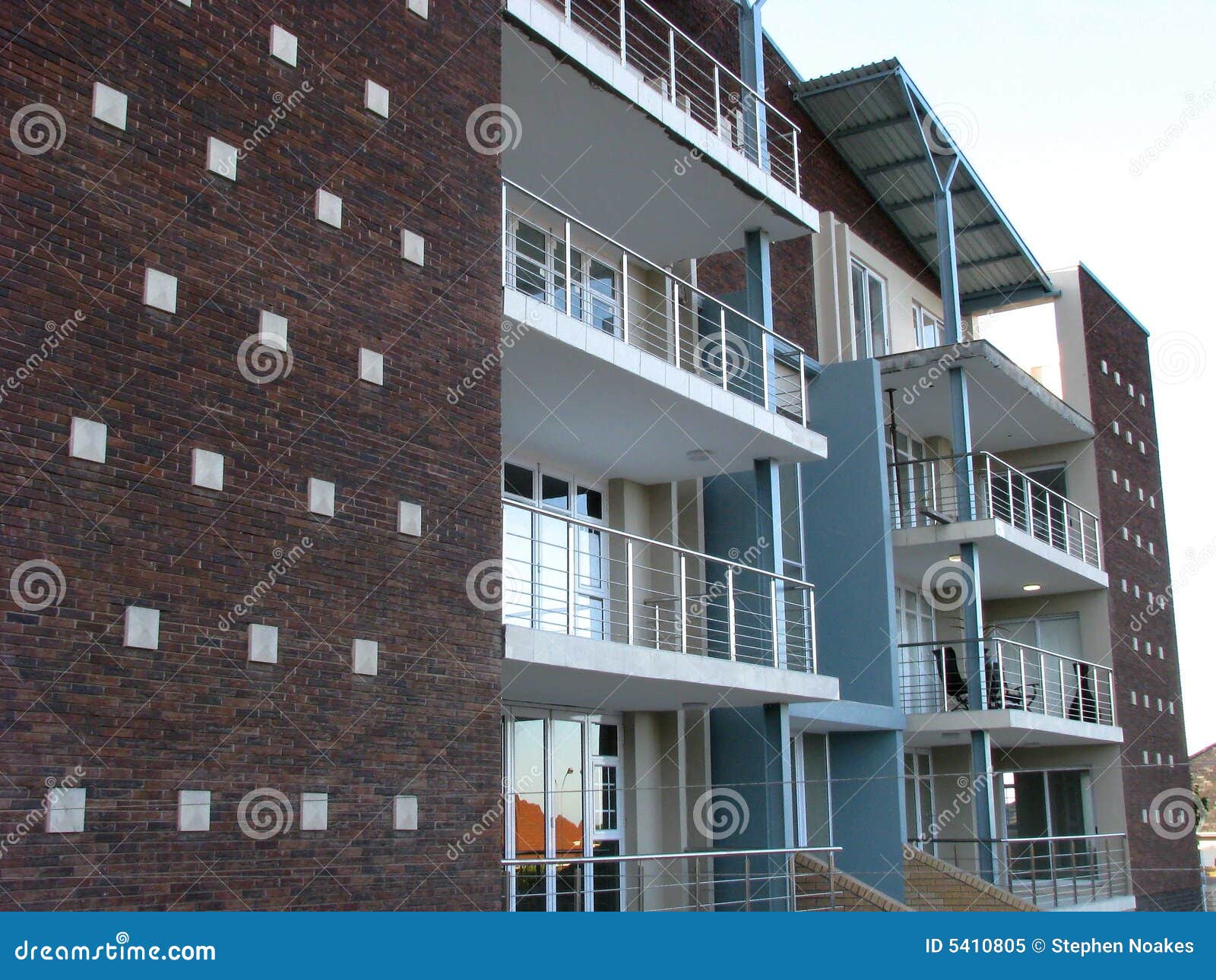 Side view of apartments stock image. Image of tall, blue - 5410805