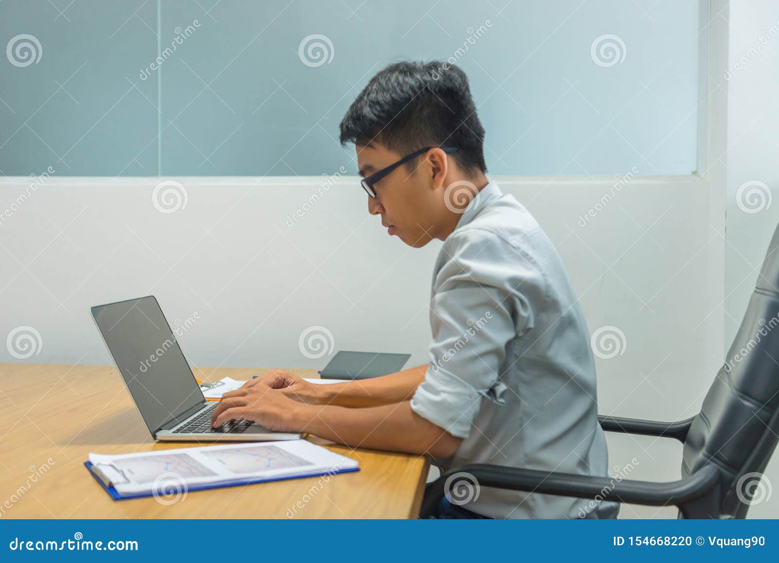 Side View of Asian Man Using Laptop Stock Photo - Image of data ...
