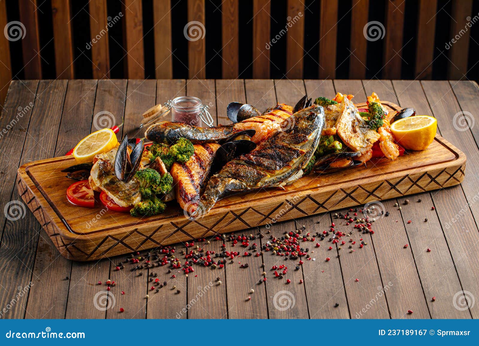 Assorted Grilled Fish Set on Wooden Serving Board Stock Image - Image ...