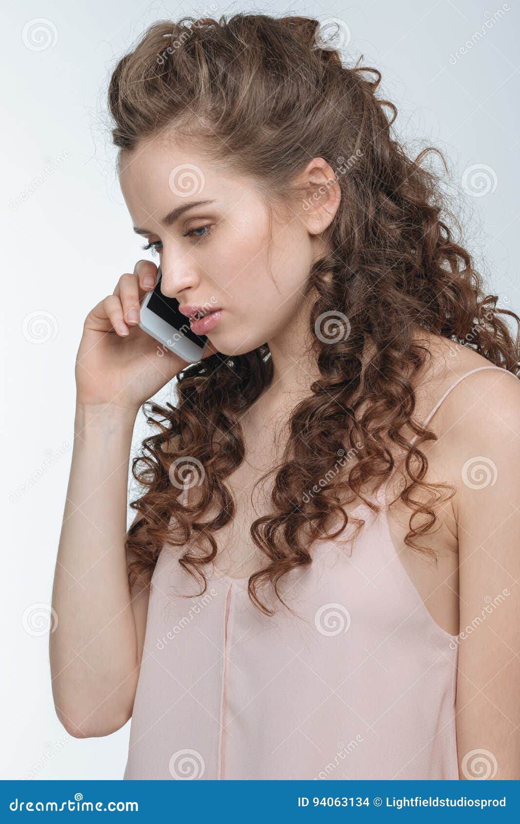 Side View of of Attractive Young Woman Talking on Smartphone Stock ...