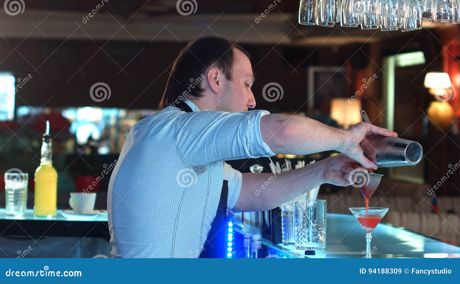 Side View of Bartender Pouring Mixed Liqueur into Prepared Glass ...