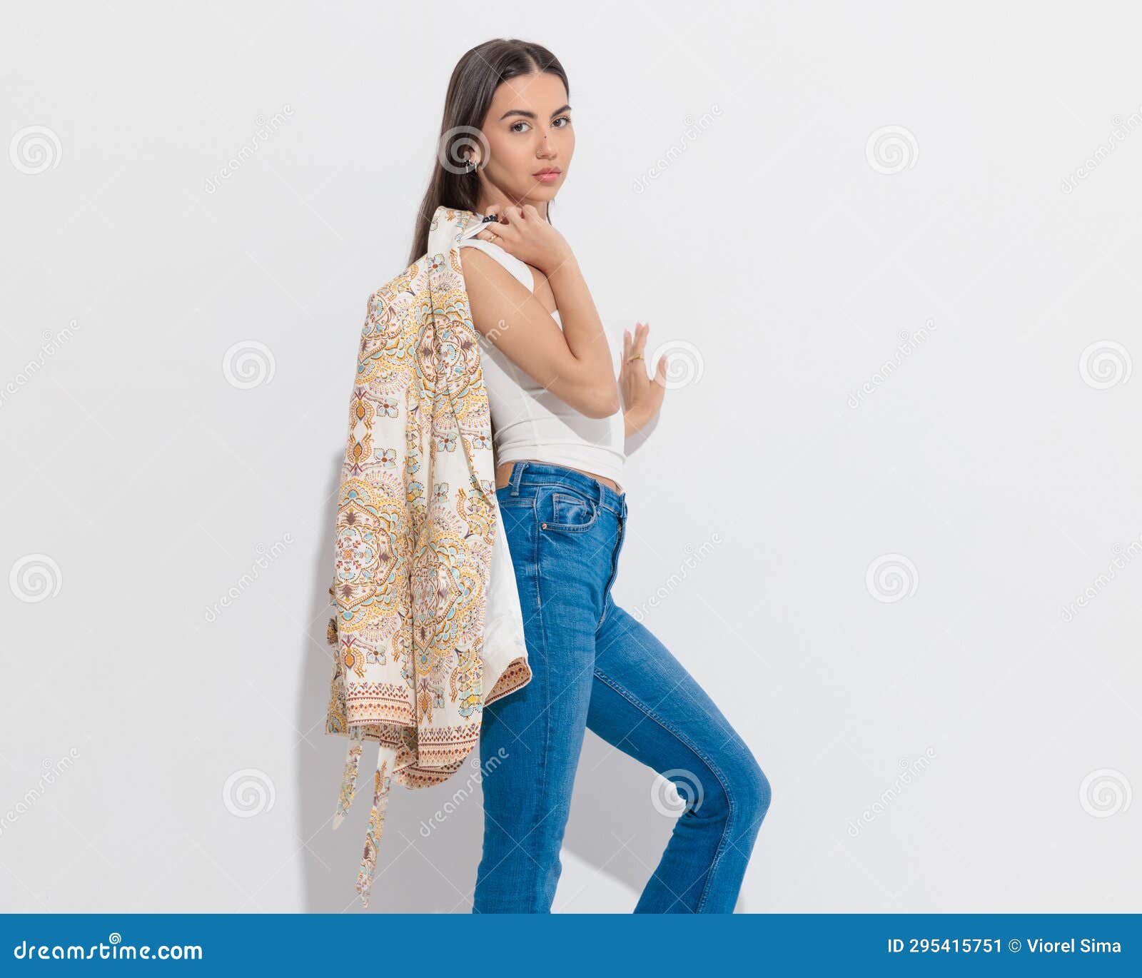 Side View of Beautiful Smart Casual Girl with Jacket on Shoulder Posing ...