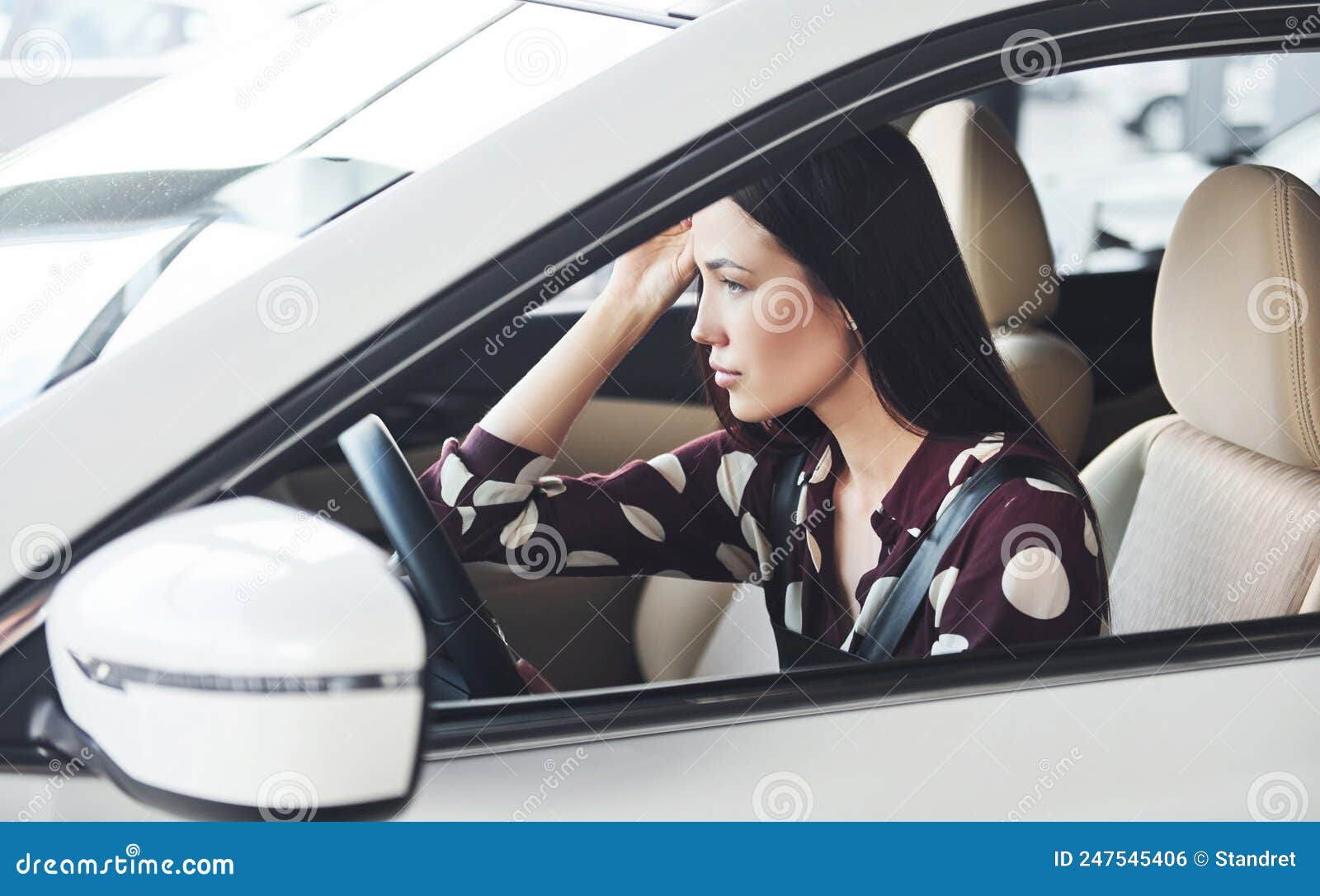 Side View of Beautiful Young Brunette that Inside of Modern Automobile ...