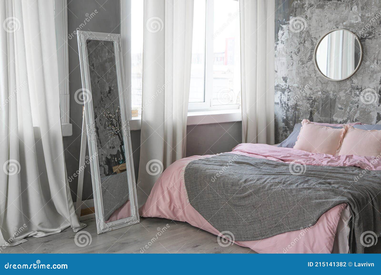 Side View on a Bed with Grey and Pink Bedding and White Mirror Stock ...