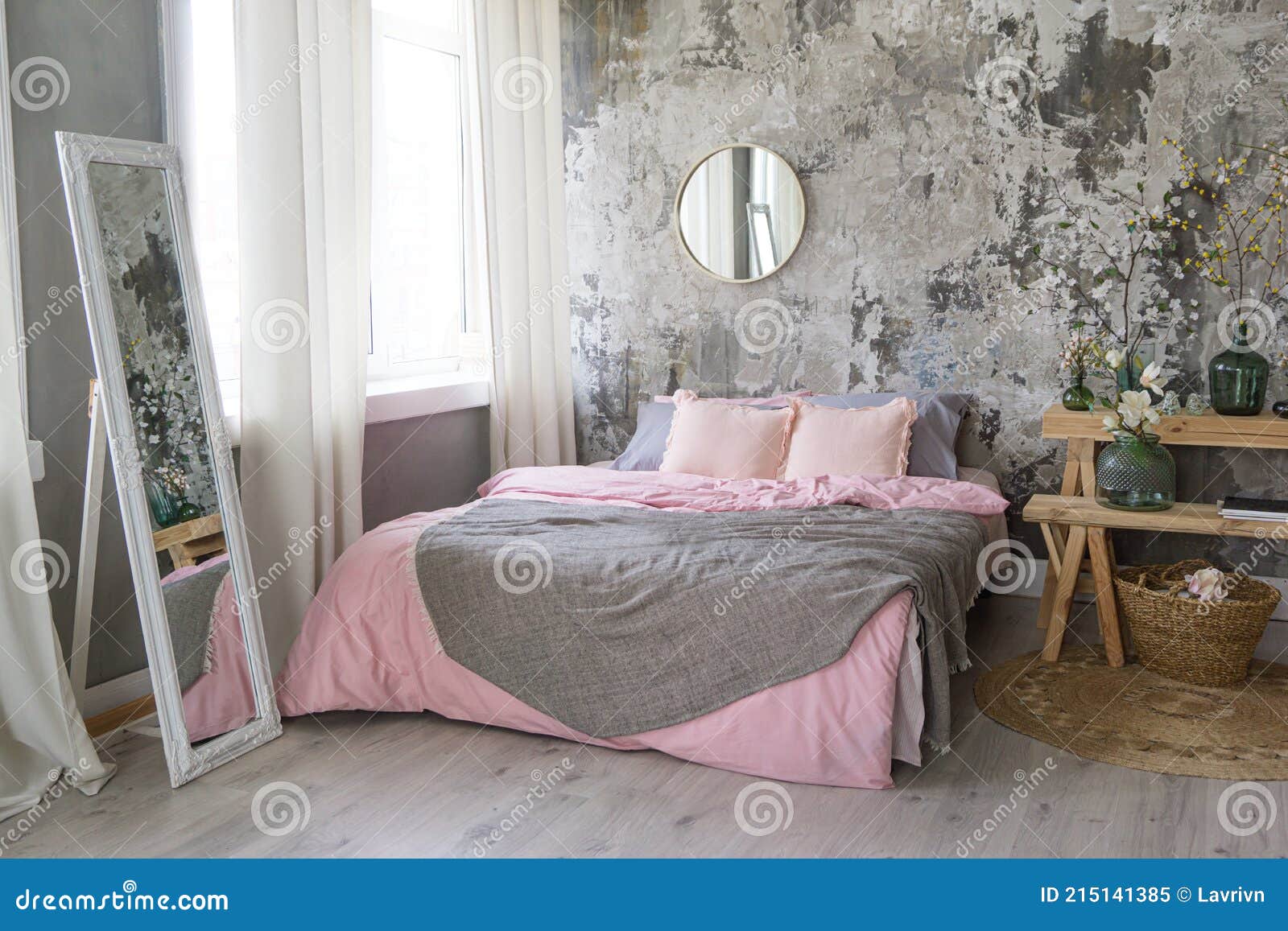 Side View on a Bed with Grey and Pink Bedding, White Mirror and Vases ...