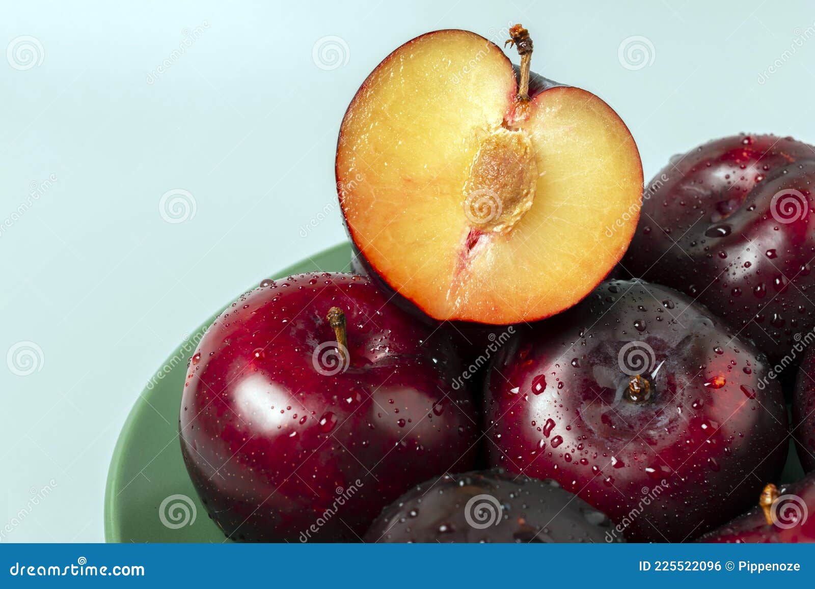 Side View of Big Red Plums on Green Plate Stock Photo - Image of bright ...