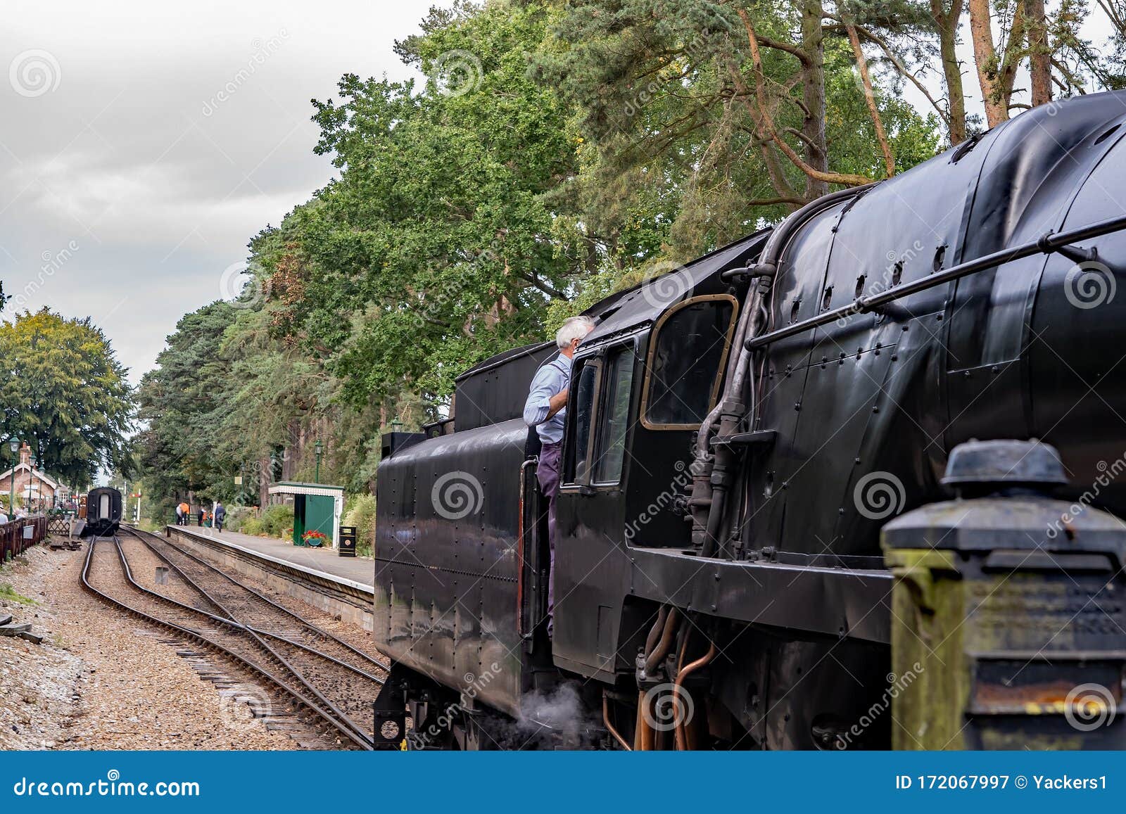 Close Up and Side on View of a Black Steam Train and Its Driver ...