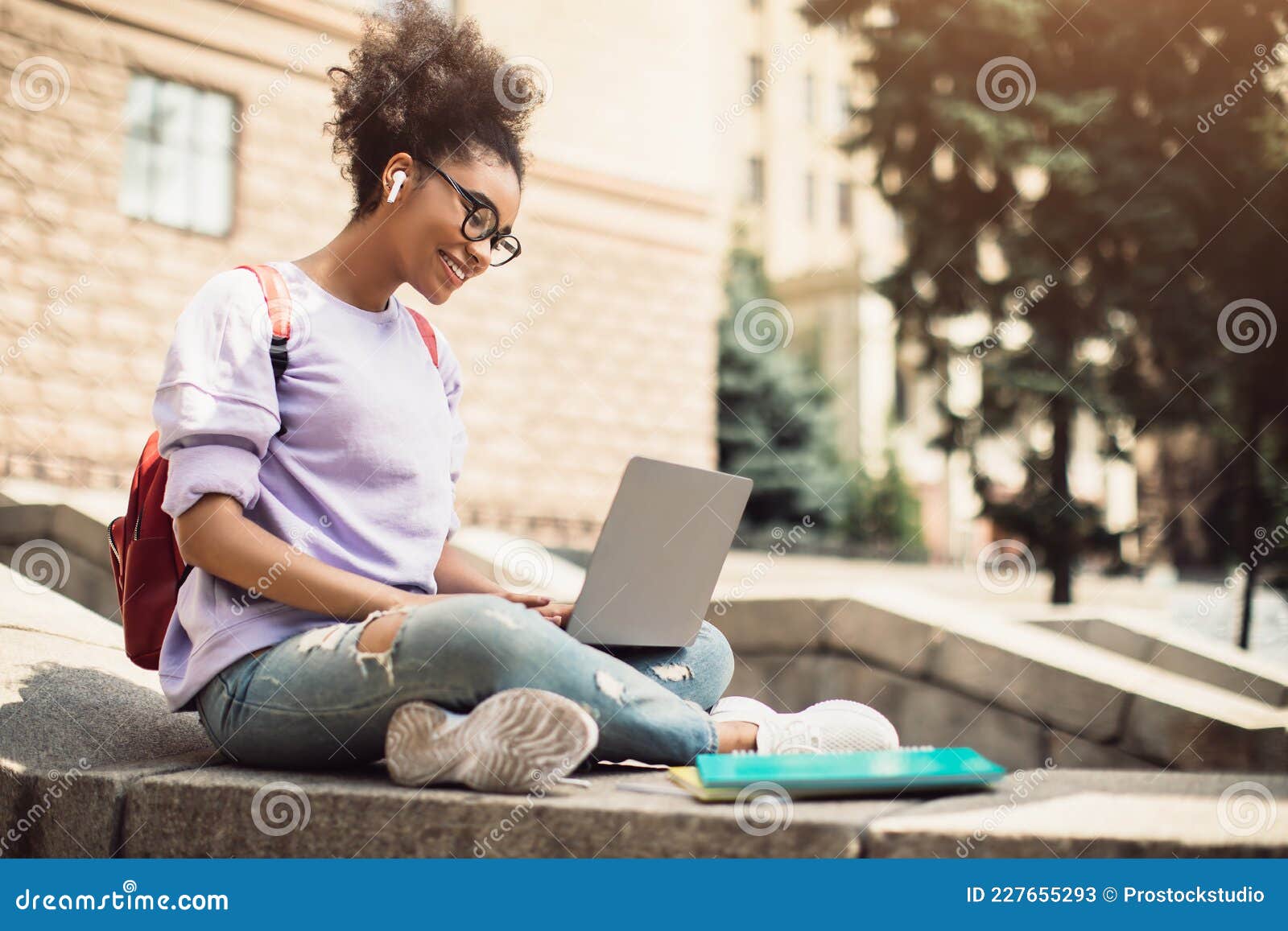 Side-View of Black Student with Laptop Watching Educational Webinar ...