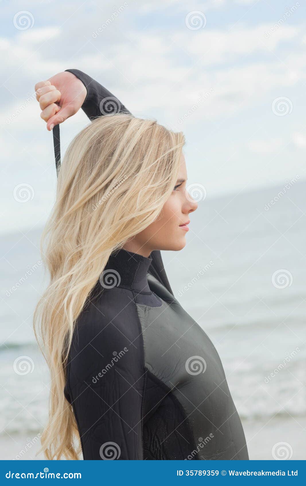 Side View of a Blond in Wet Suit Standing at Beach Stock Image - Image ...