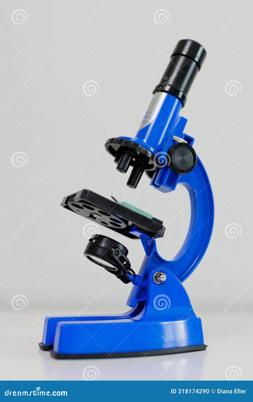 Side View of Blue Microscope on White Table Stock Photo - Image of ...