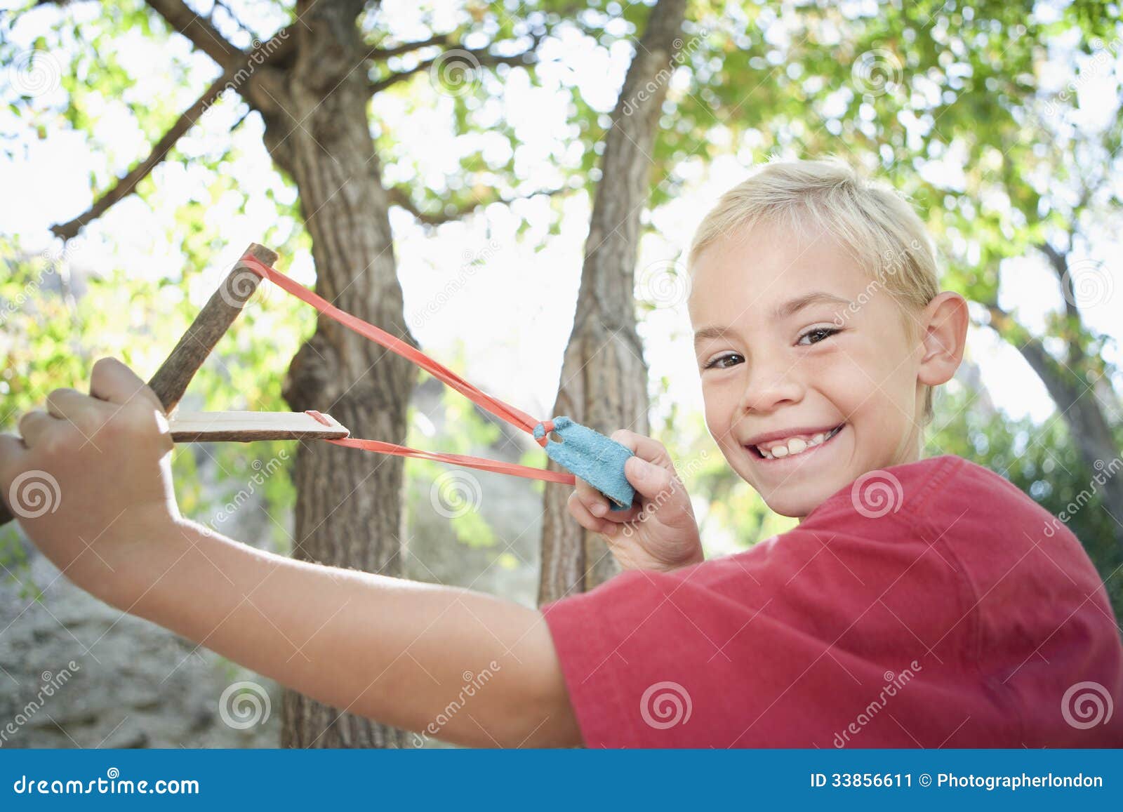 Side View of Boy Using Slingshot Stock Image - Image of horizontal ...