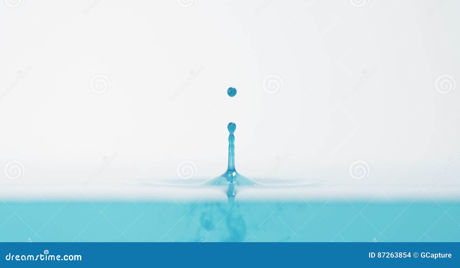 Side View of Bright Blue Water Drop with Accurate Splash Stock Photo ...