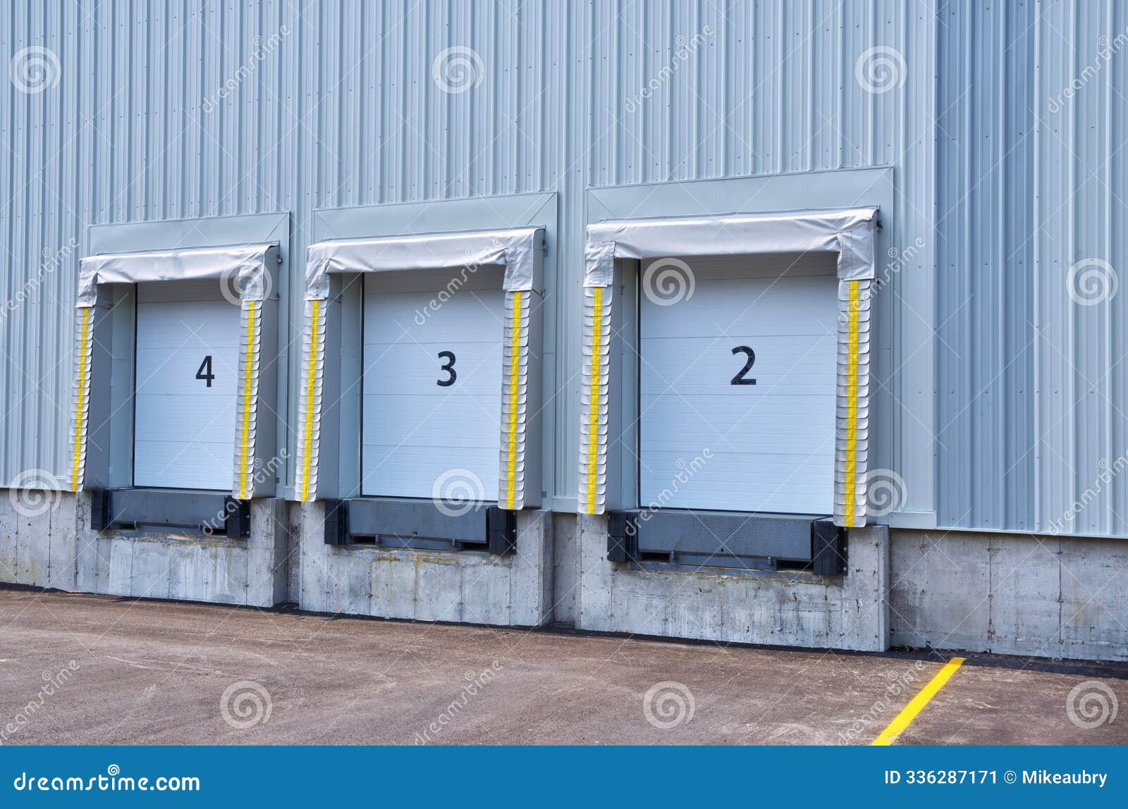 Side View of a Building with Three Industrial Loading Docks. Stock ...
