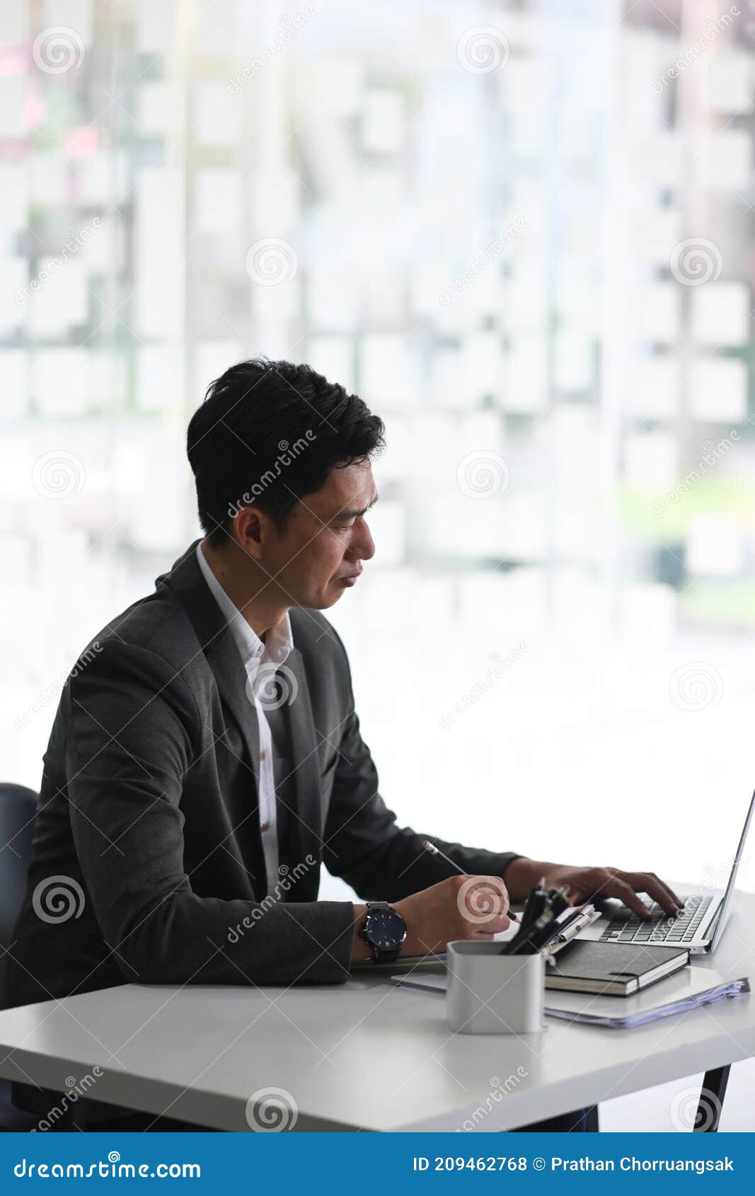 Businessman Concentrate Working in Laptop Computer in Modern Office ...