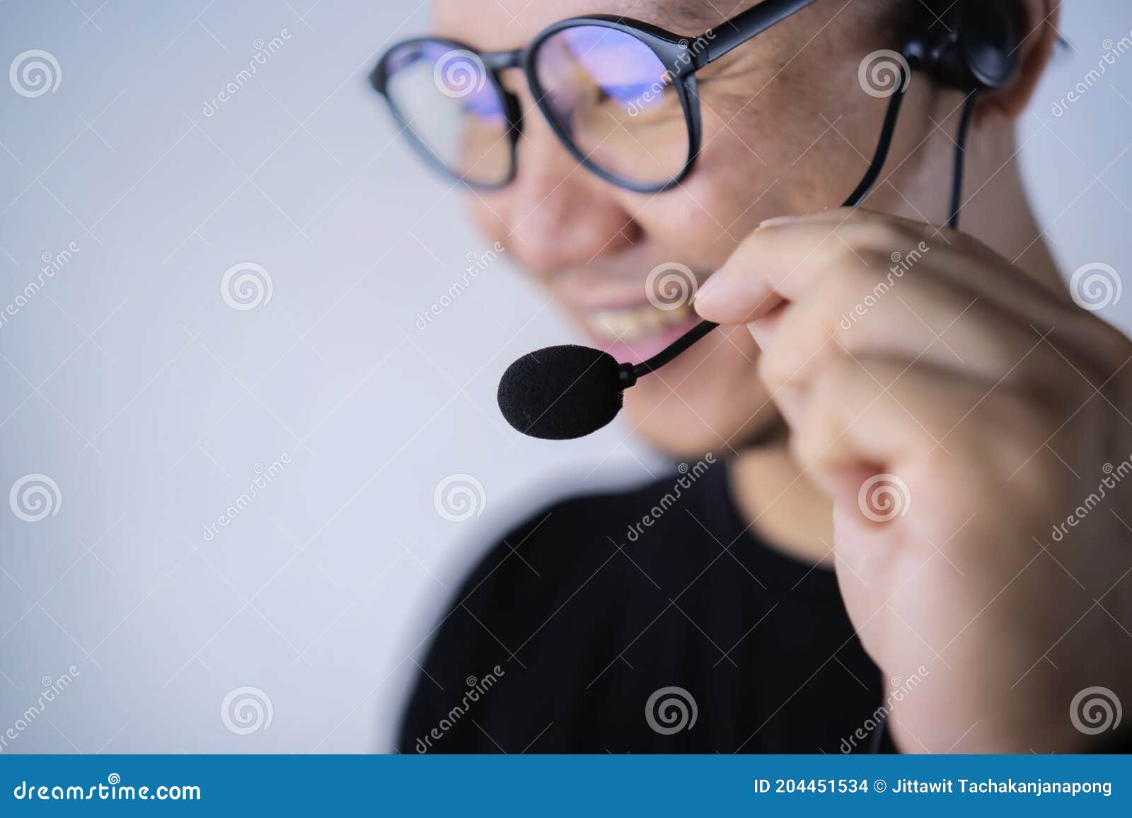 Side View of the Call Center Operator Focused Asian Man with a Headset ...