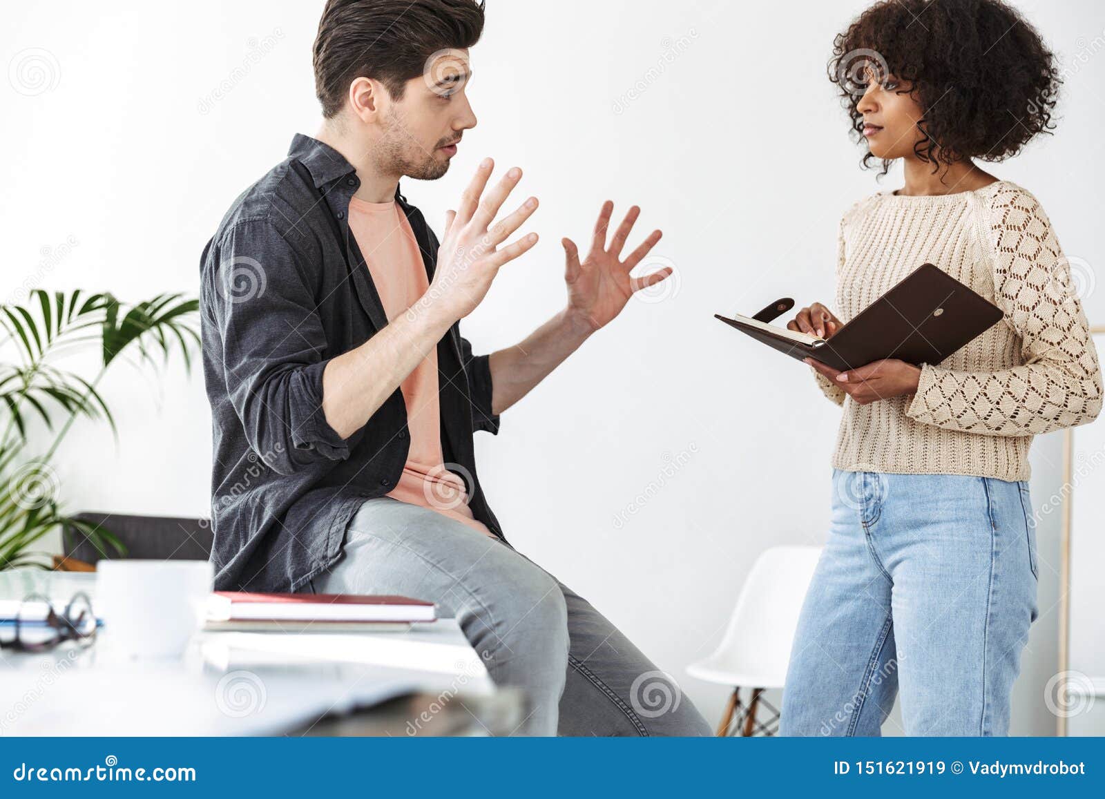 Calm And Concentrated Young Sportgirls Sit In With Leggs Crossed And ...