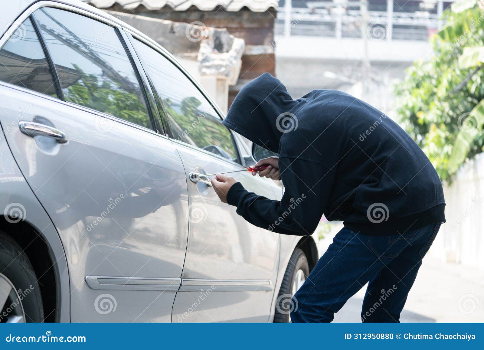 Side View of Car Thief in Action Stock Photo - Image of mask, crime ...