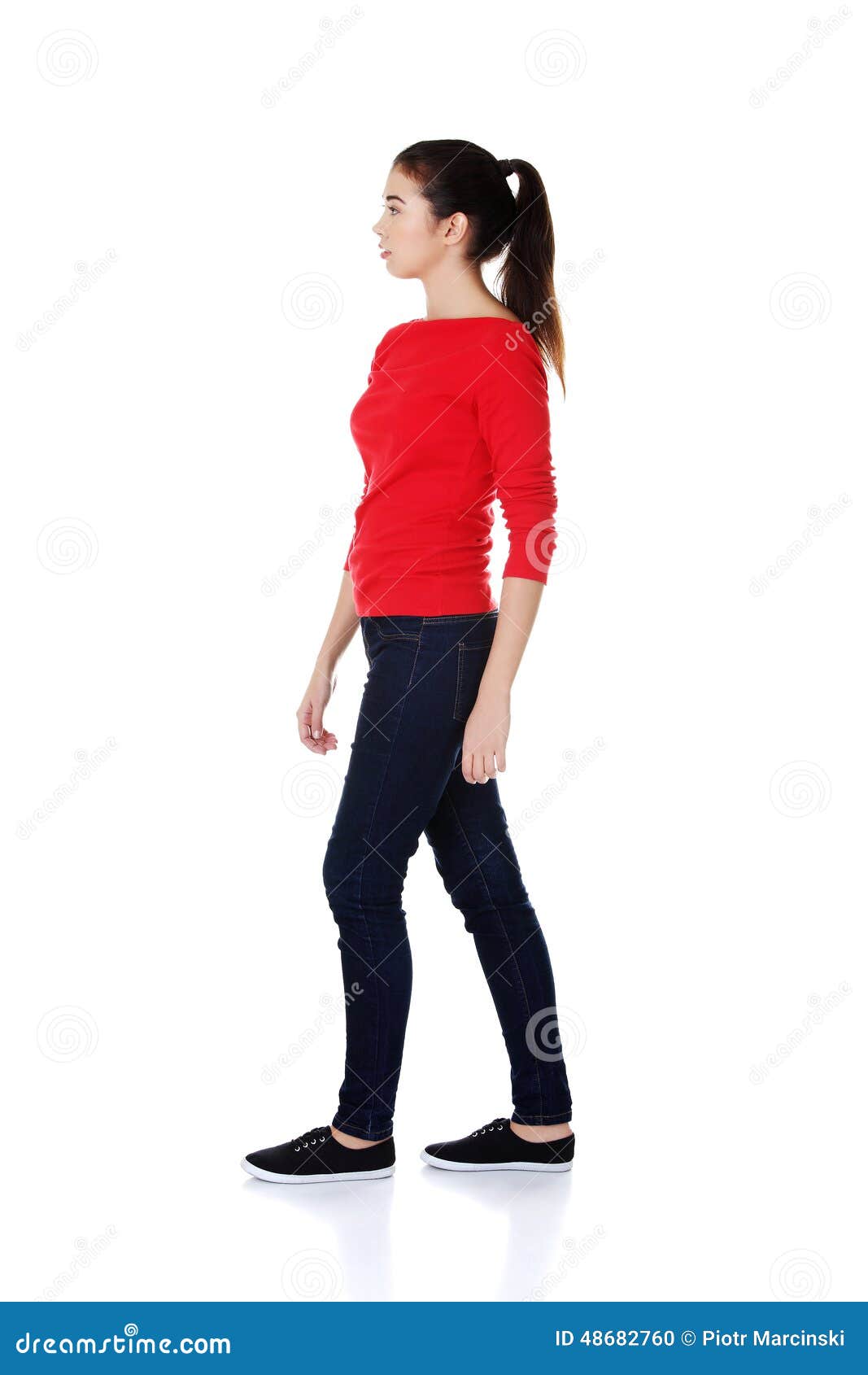 Side View of a Casual Young Woman Walking Stock Photo - Image of ...