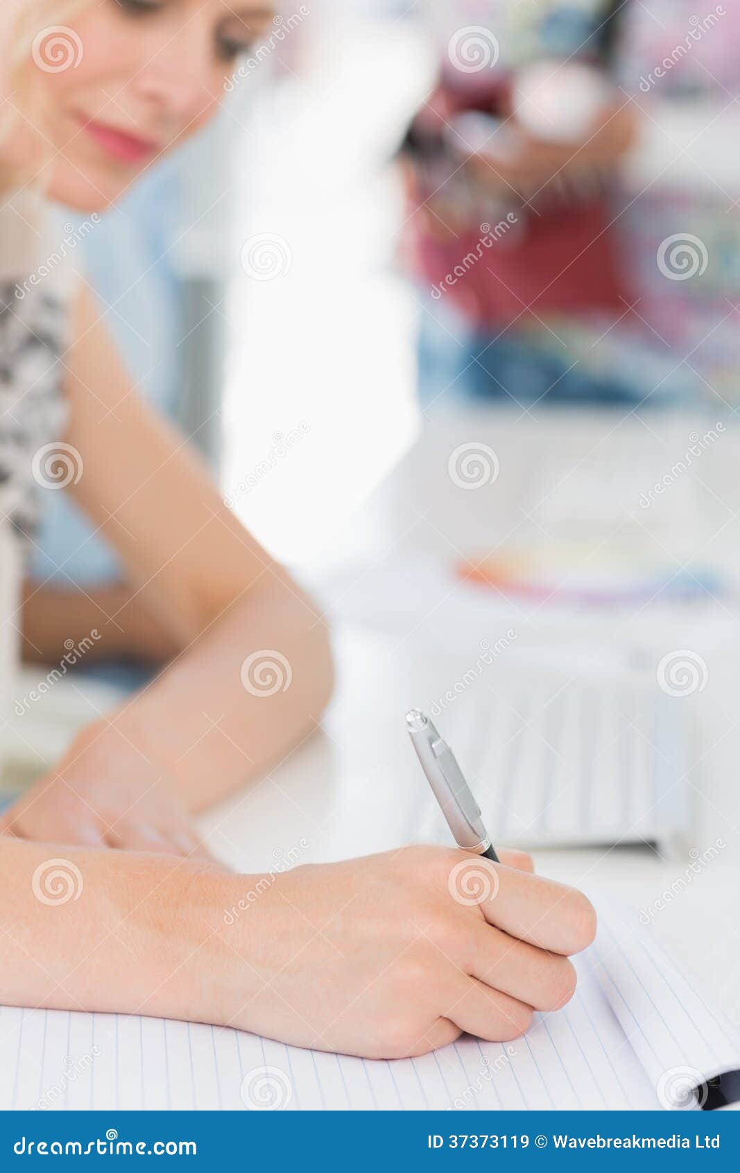 Side View of a Casual Young Woman Writing Notes Stock Image - Image of ...