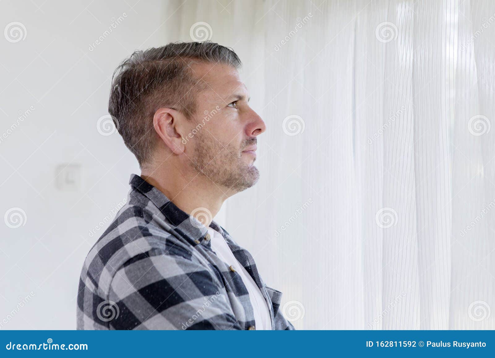 Side View of Caucasian Man Thinks Near the Window Stock Photo - Image ...