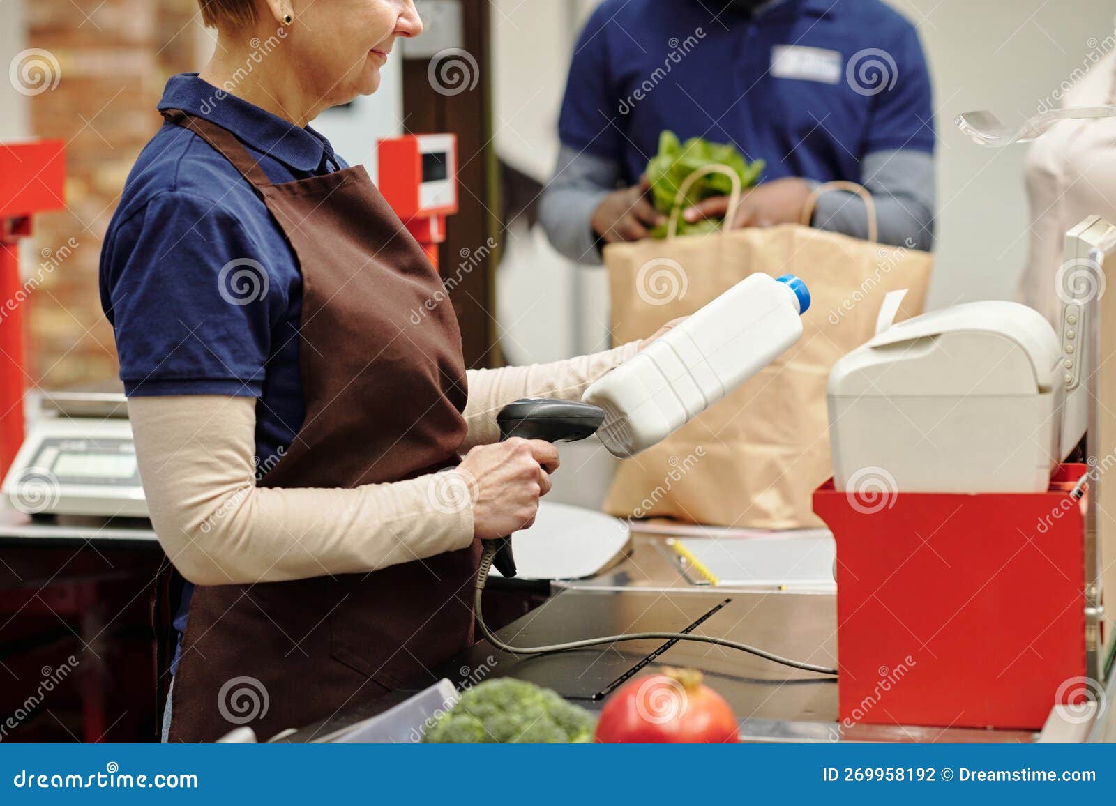 Side View of Checkout Cashier Scanning Bar Code on White Plastic Bottle ...