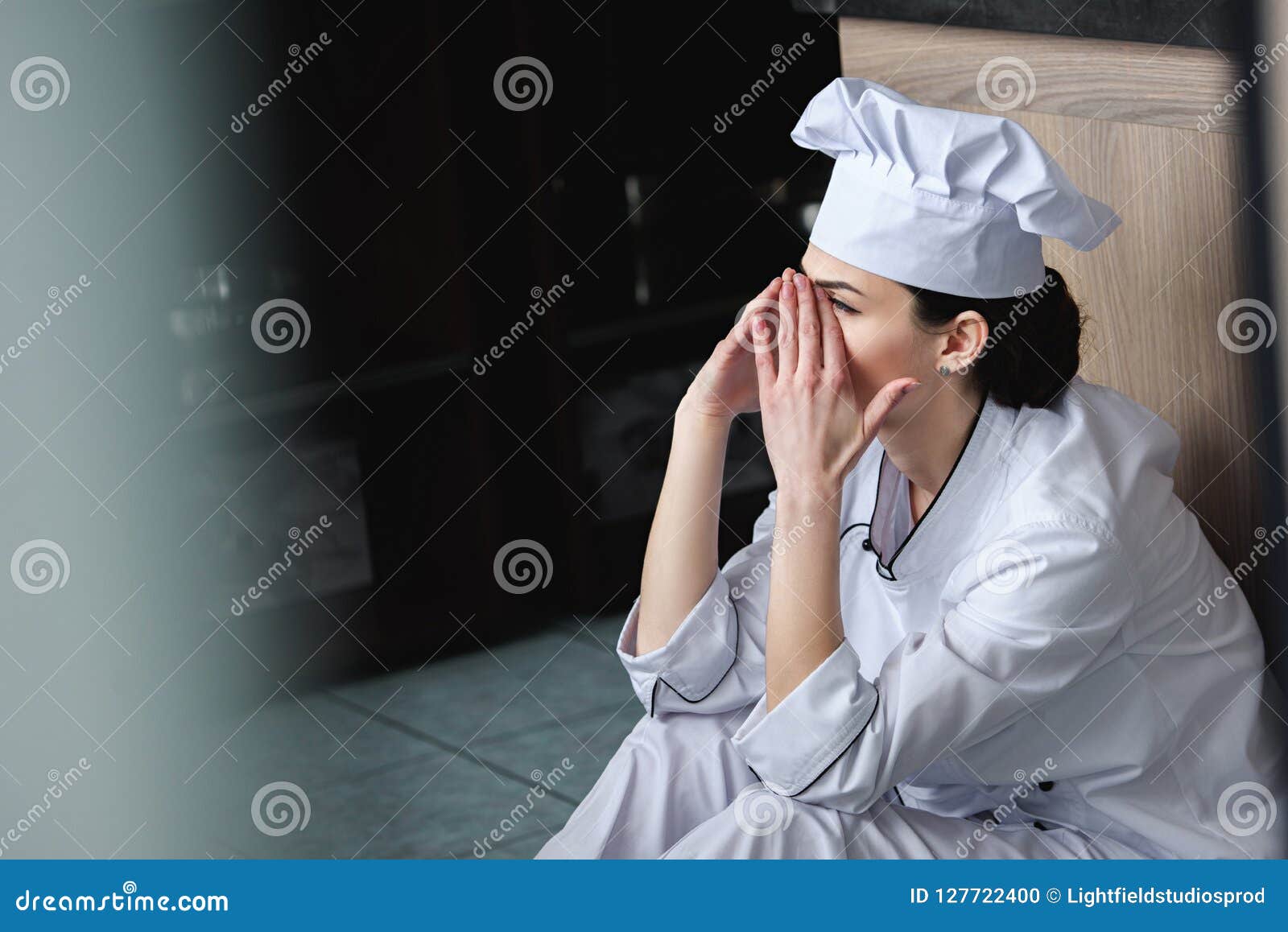 Side View of Chef Crying and Sitting on Floor Stock Photo - Image of ...