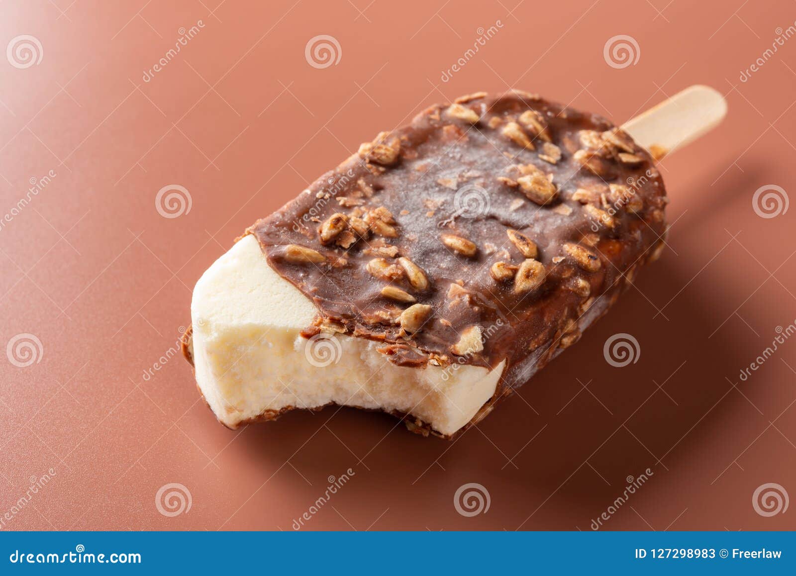Side View Chocolate Outer Ice Cream with Peanuts on Brown Background ...