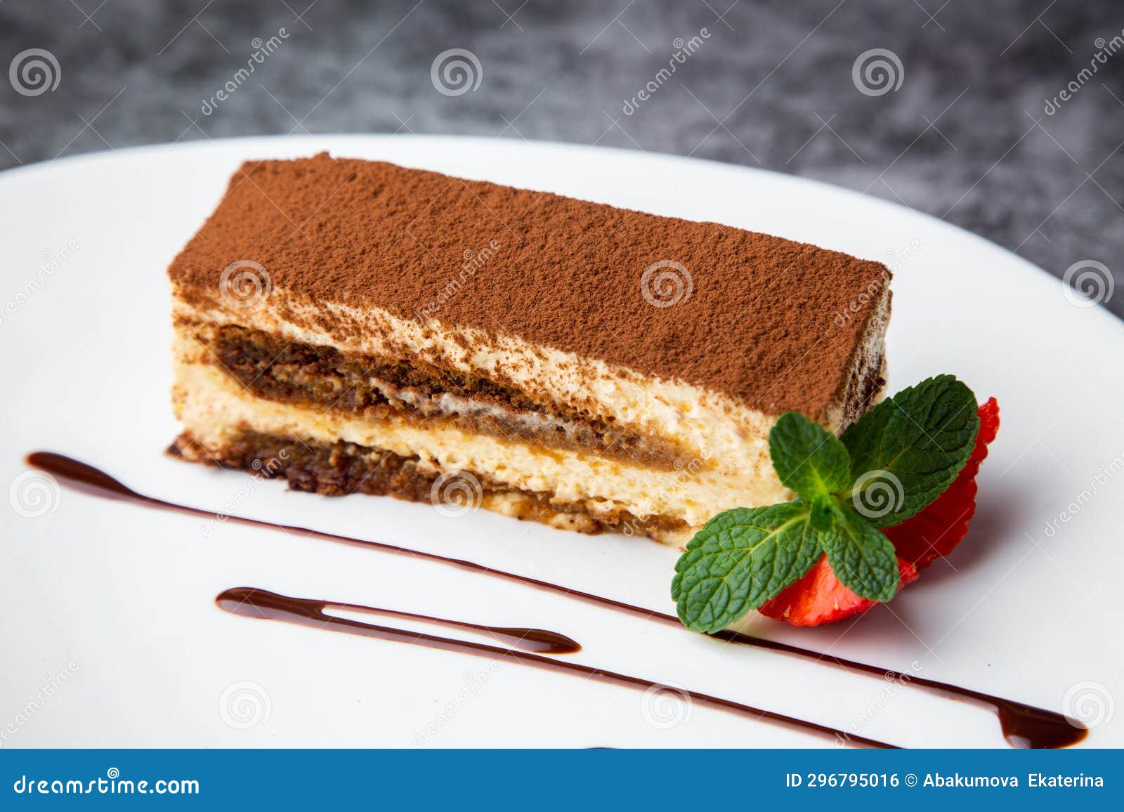 Side View of Chocolate Sponge Cake with Strawberries and Mint on a ...