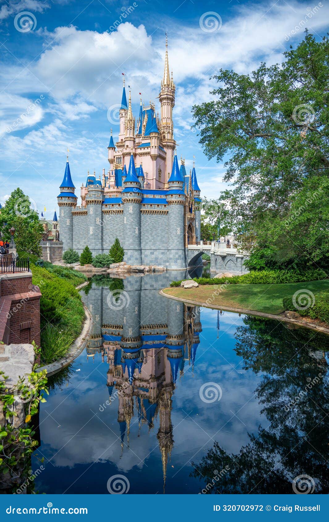 Side View of Cinderella Castle in Disney World with a Water Reflection ...