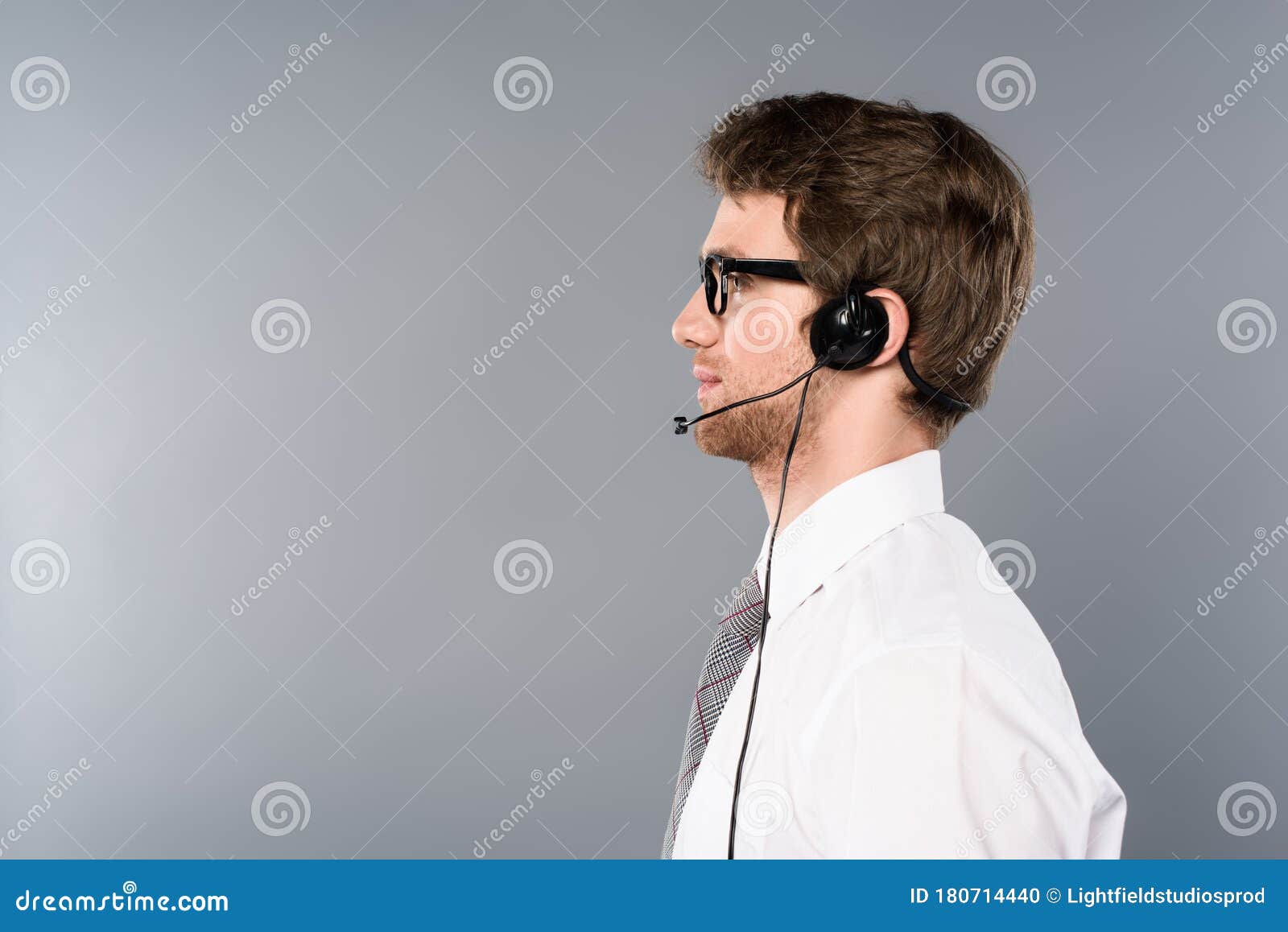 Side View of Confident Call Center Operator on Grey Background. Stock ...