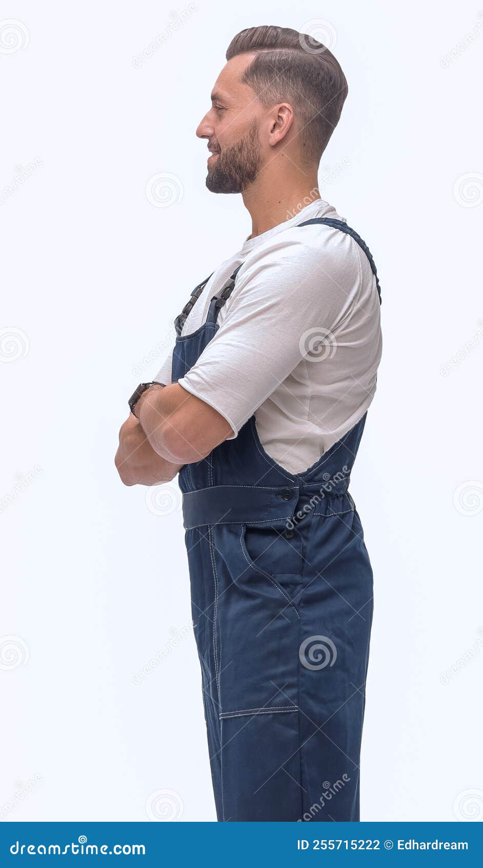 Side View. Confident Man in Overalls Looking Forward Stock Photo ...