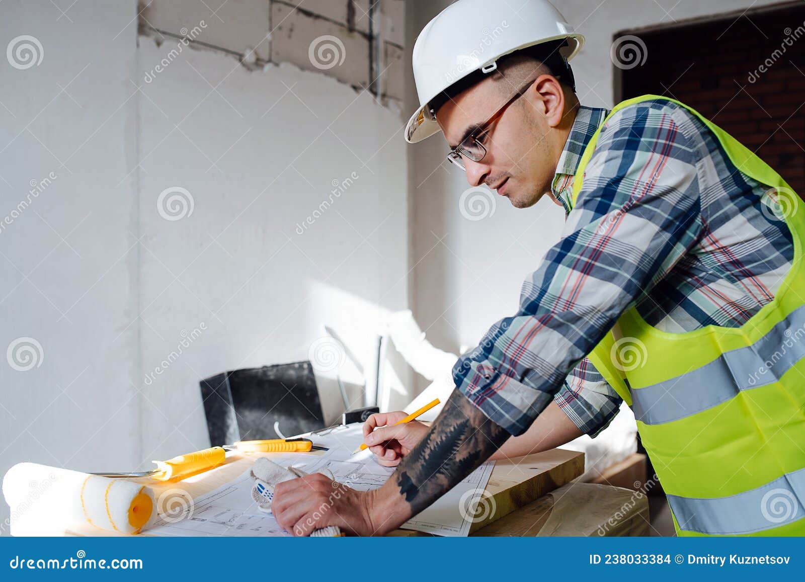 Side View Construction Engineer Drawing on a Blueprint on an Improvised ...