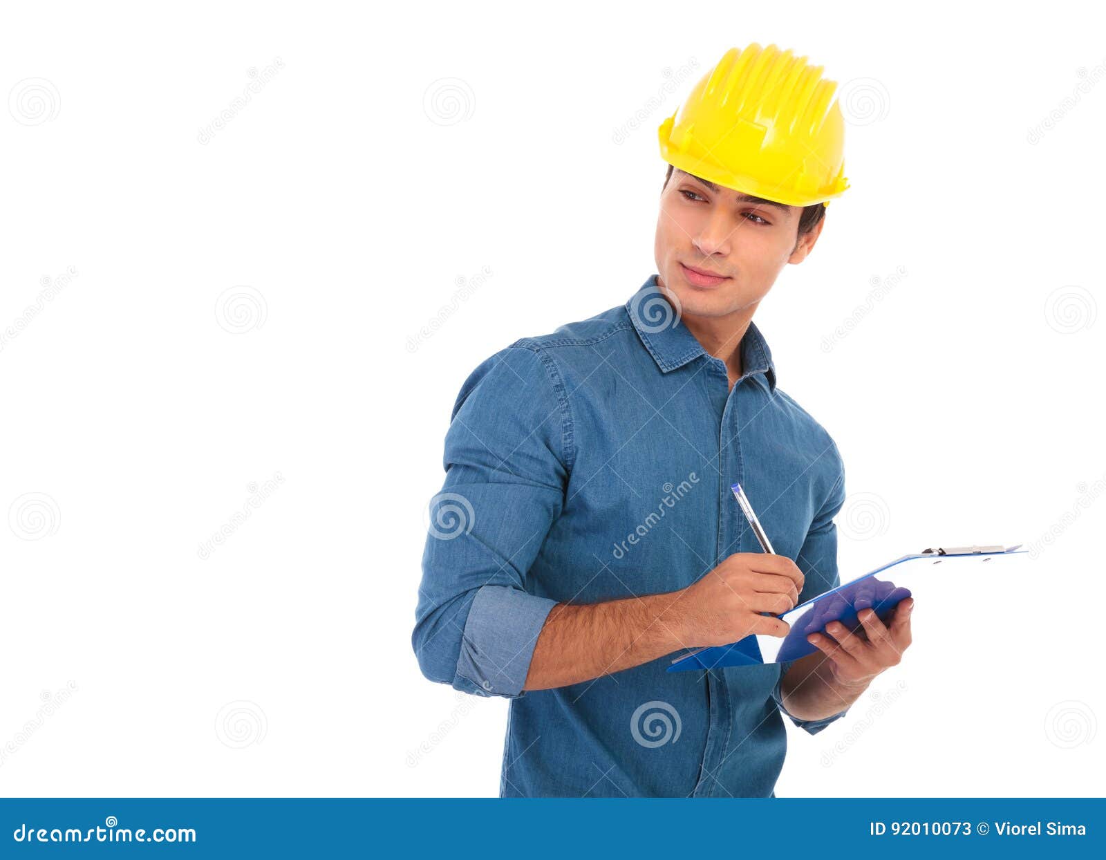 Side View of a Construction Engineering Student Writing on Clipboard ...