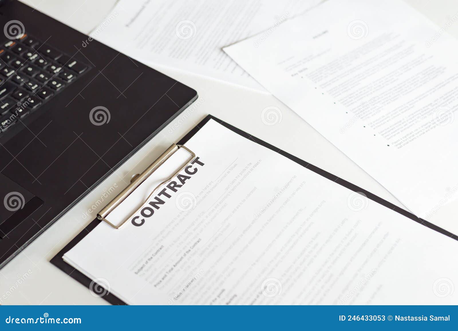 Side View of Contract in Clipboard Lying at Office on Table with Laptop ...