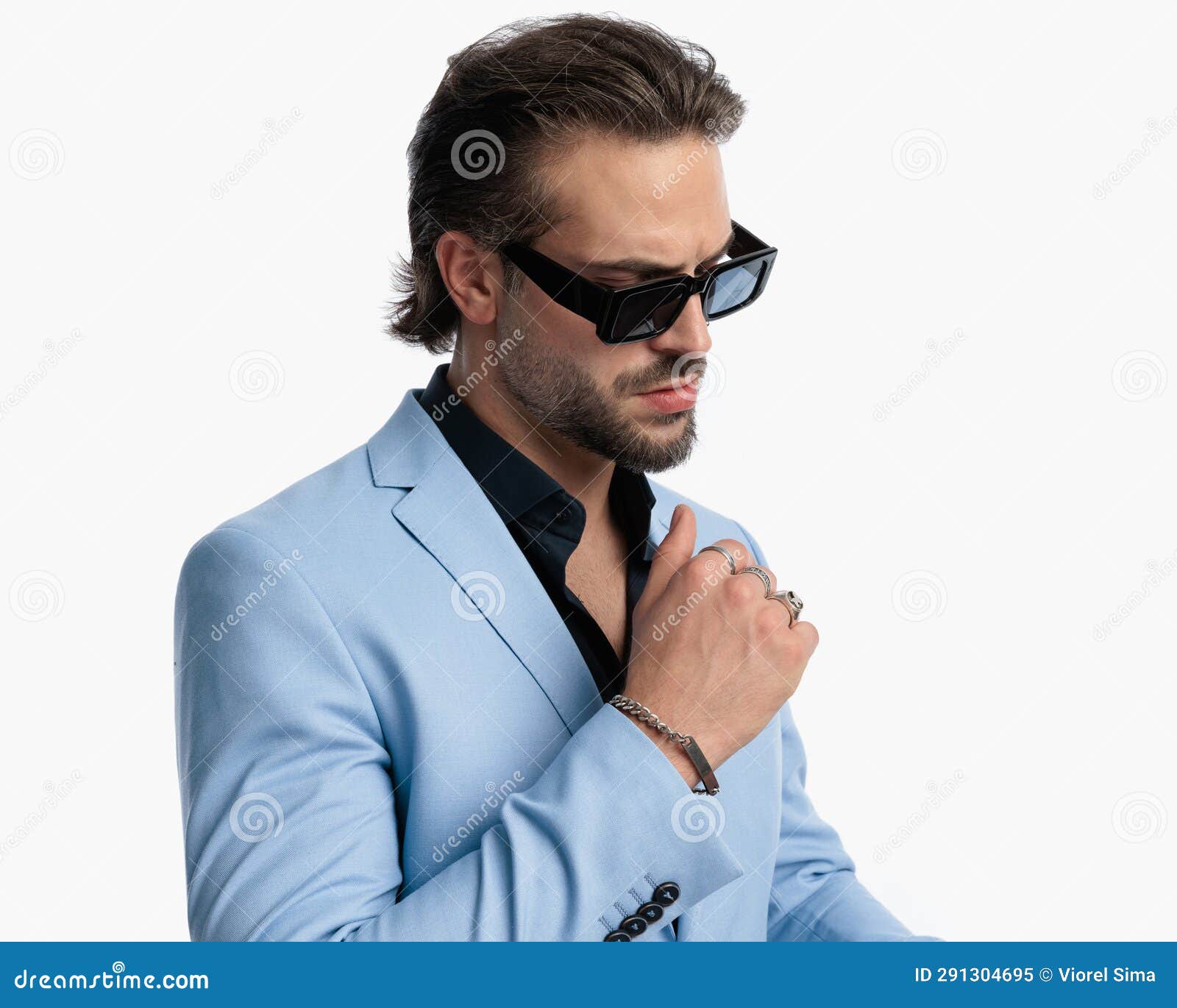 Side View of Cool Fashion Man with Sunglasses Looking Down and Posing ...