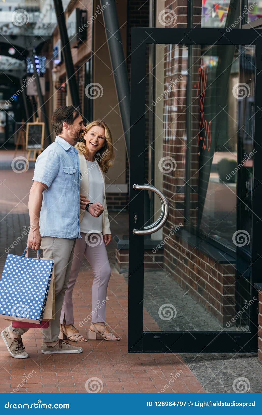 Side View of Couple Entering Stock Image - Image of handsome, together ...