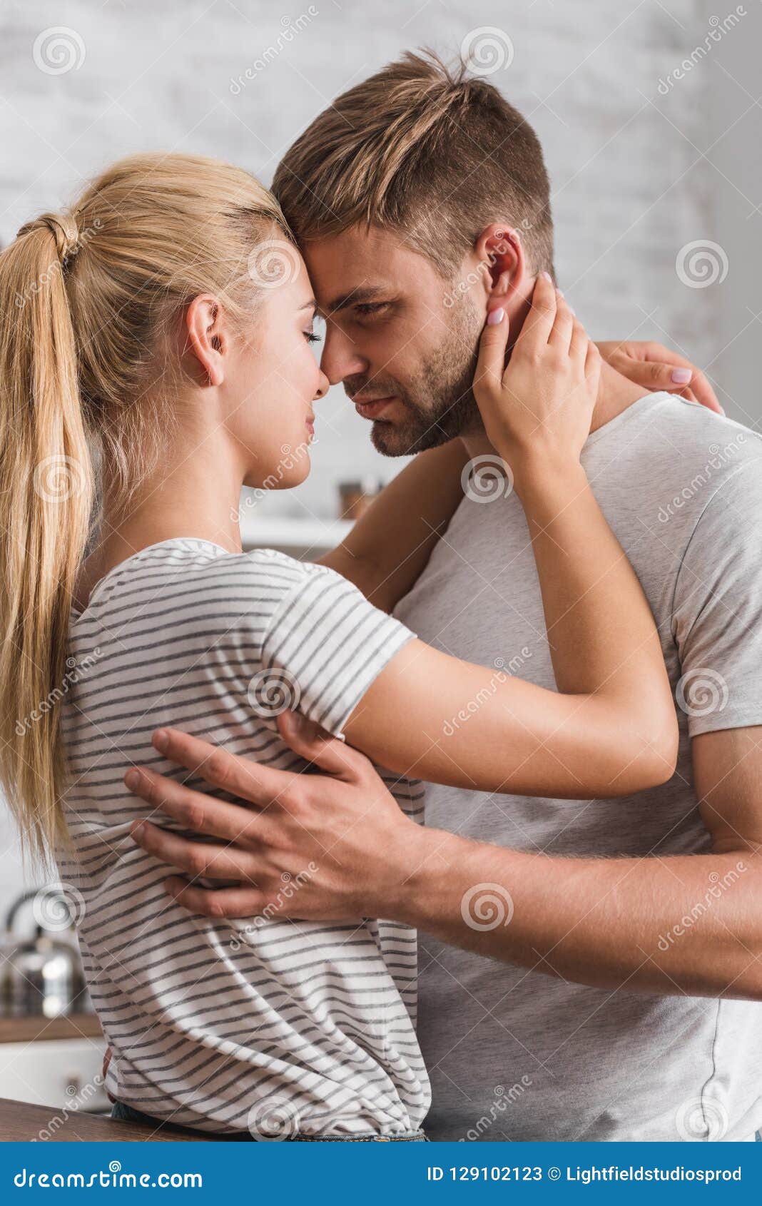 Side View of Couple Hugging Stock Image - Image of hugging, kitchen ...