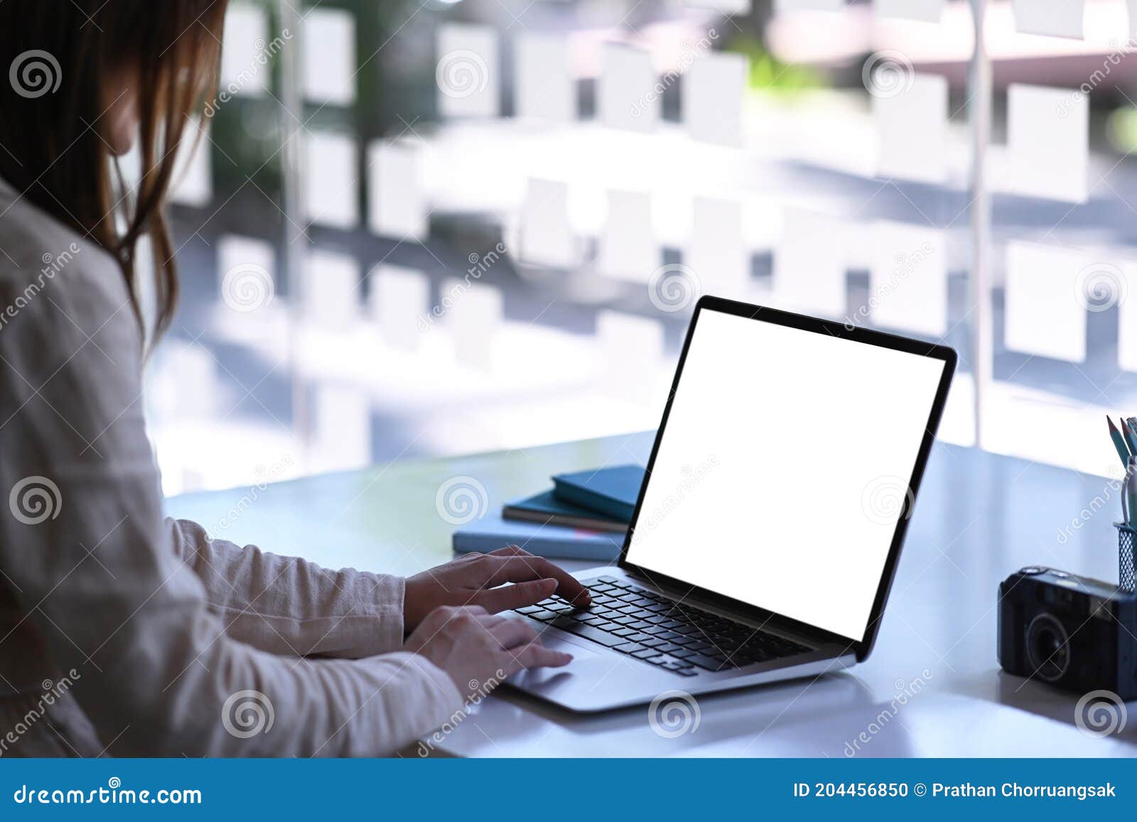 Side View of a Creative Female Freelancer Working and Sitting Front ...