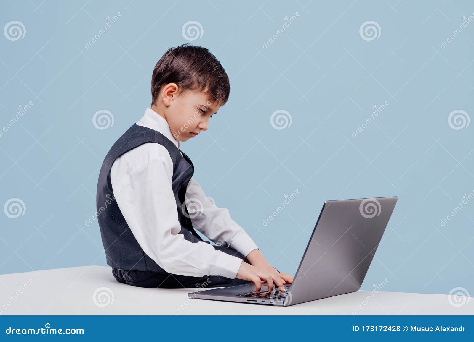 Side View of Curious Little Boy Typing on Laptop Stock Photo - Image of ...