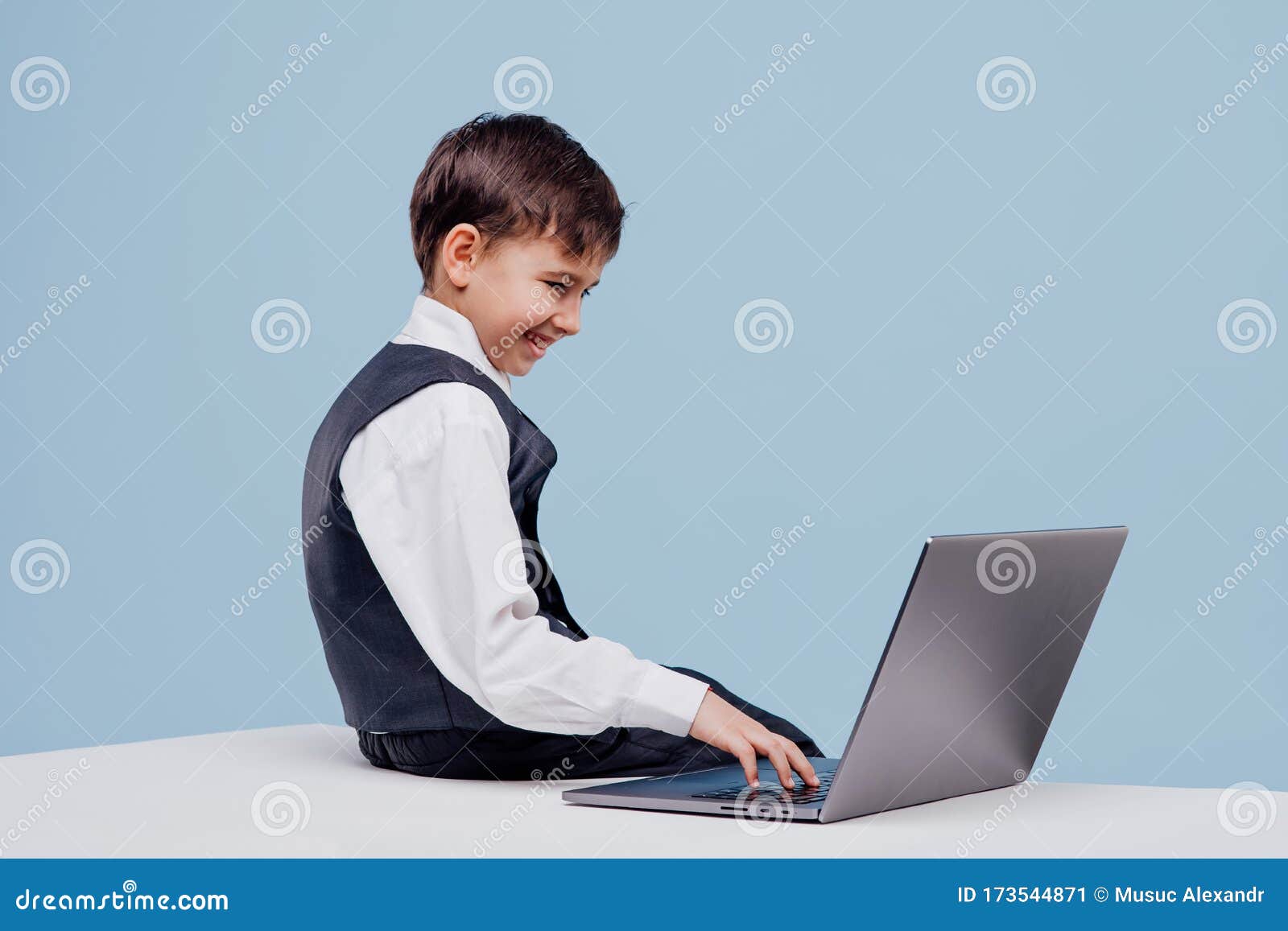 Side View Of Curious Little Boy Typing On Laptop Stock Image - Image of ...