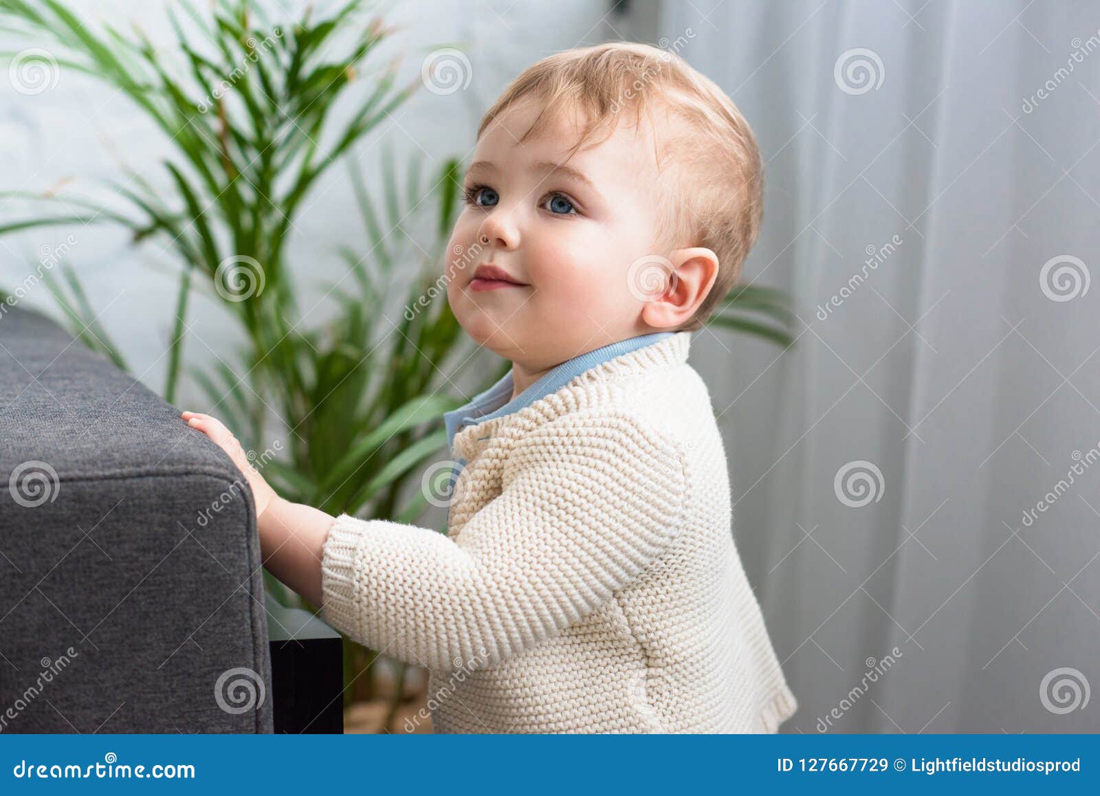 Side View of Cute Little Baby Standing at Sofa Stock Image - Image of ...