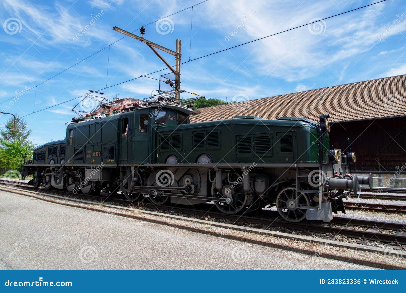 Side View of a Dark Green Train Parked Near a Station Editorial Photo ...