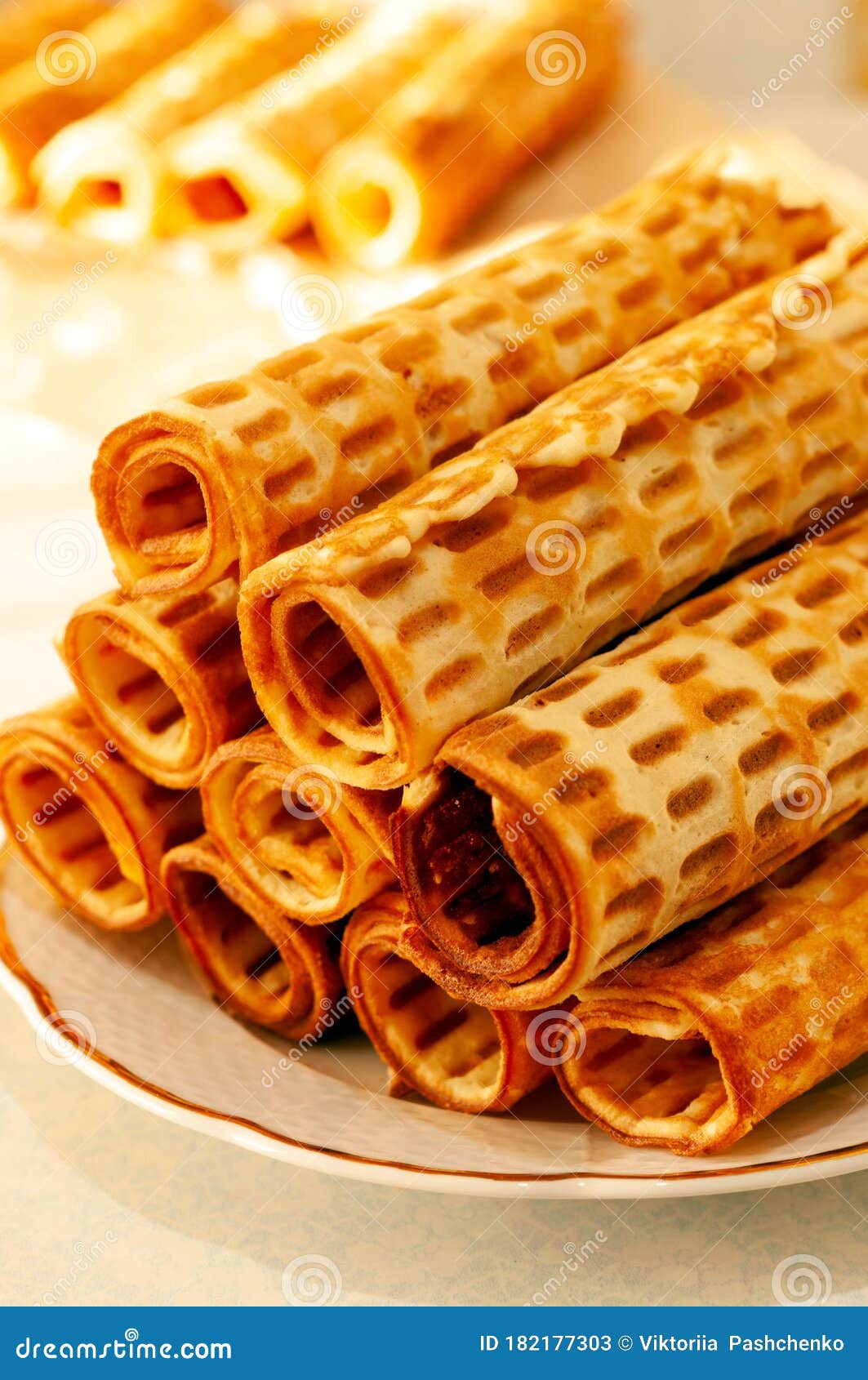 Rolled Waffles in Stack on Parchment Paper and White Plate at Home ...