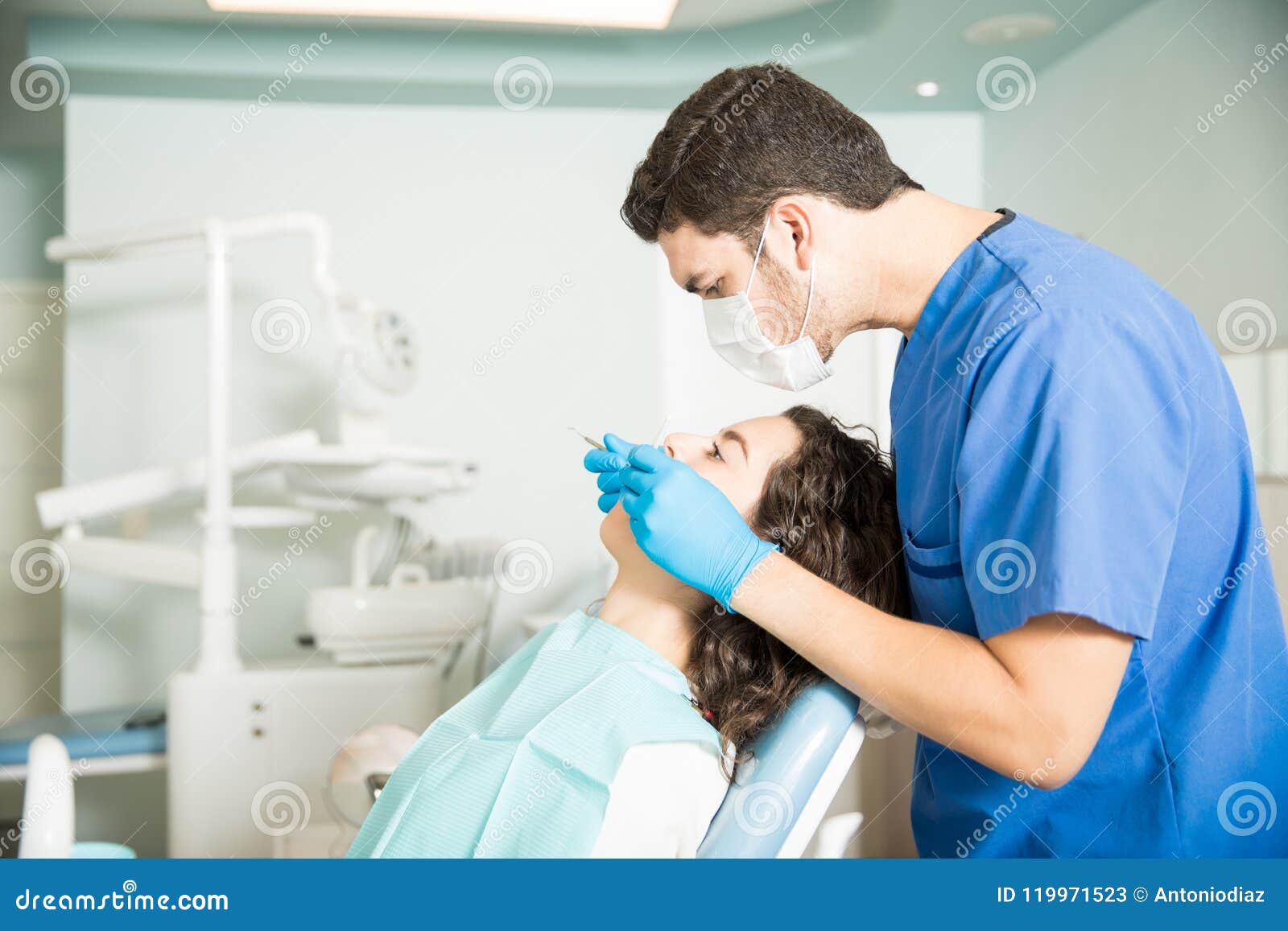 Side View of Dentist Examining Patient in Dental Clinic Stock Image ... Side View of Dentist Examining Patient in Dental Clinic Stock Image ...
