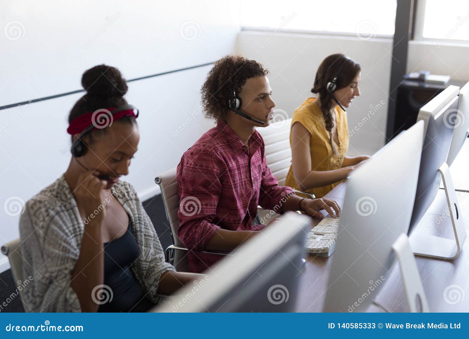 Call Centre Agents Talking on Headset in Office Stock Image - Image of ...