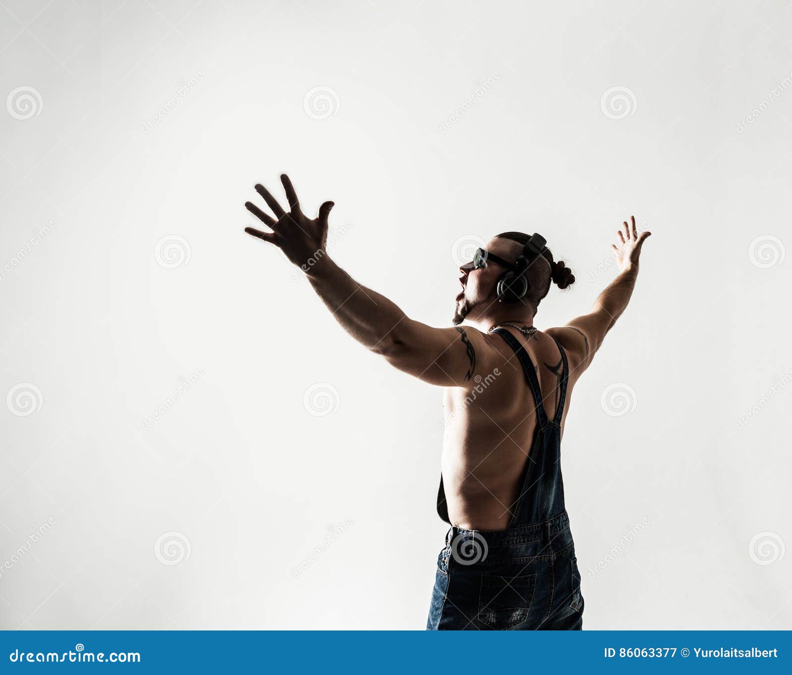 Side View - DJ - Rapper with Headphones on a Light Background Pe Stock ...