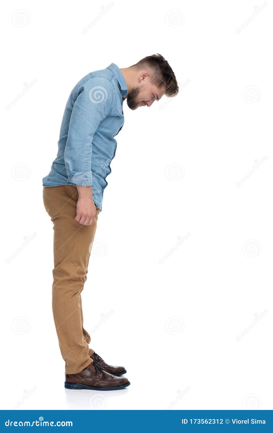 Side View of a Eager Casual Man Curiously Looking Down Stock Photo ...