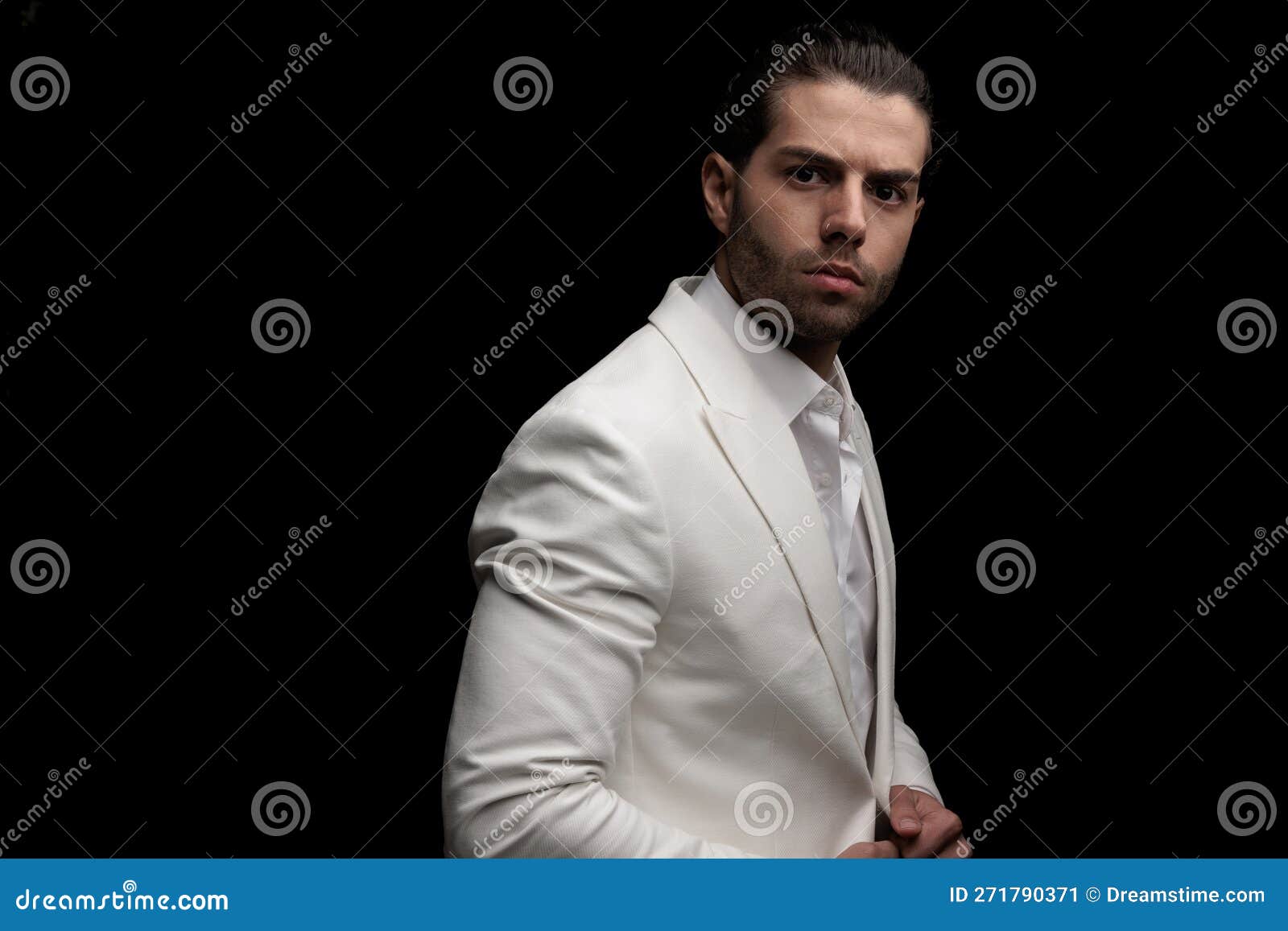 Side View of Elegant Young Man Adjusting White Suit Jacket Stock Image ...
