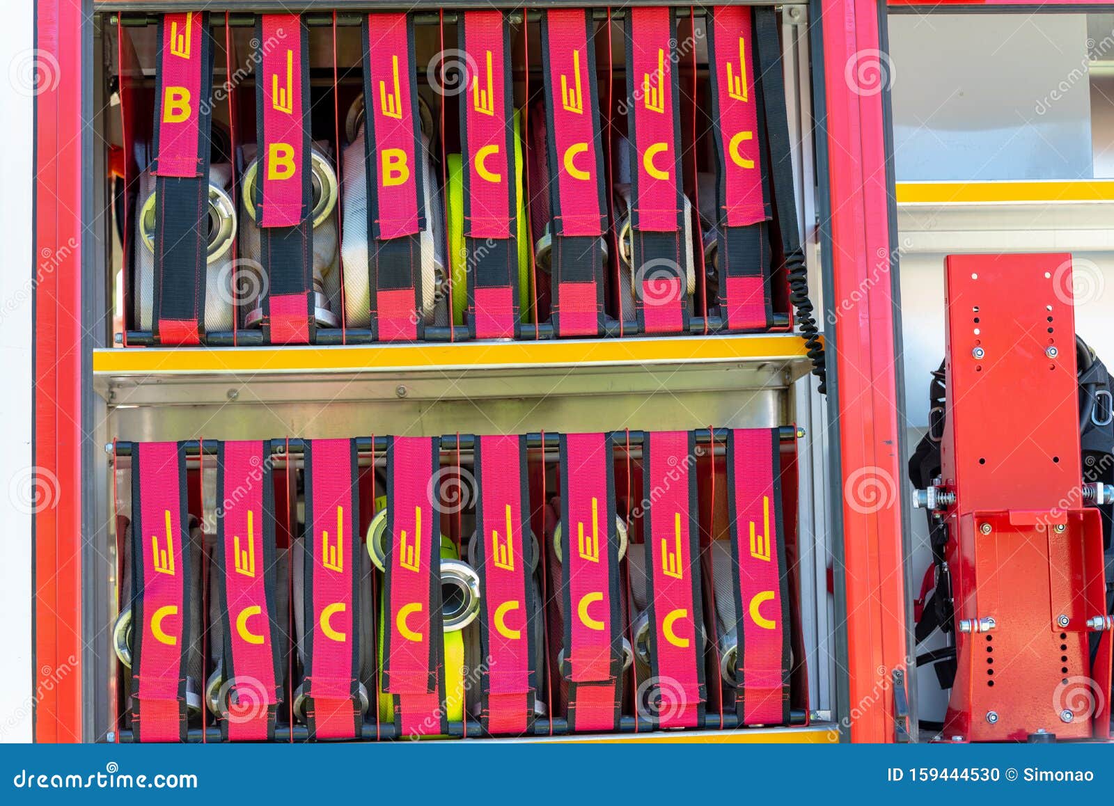 The Side View of Equipment Packed Neatly Inside a Fire Engine Stock ...
